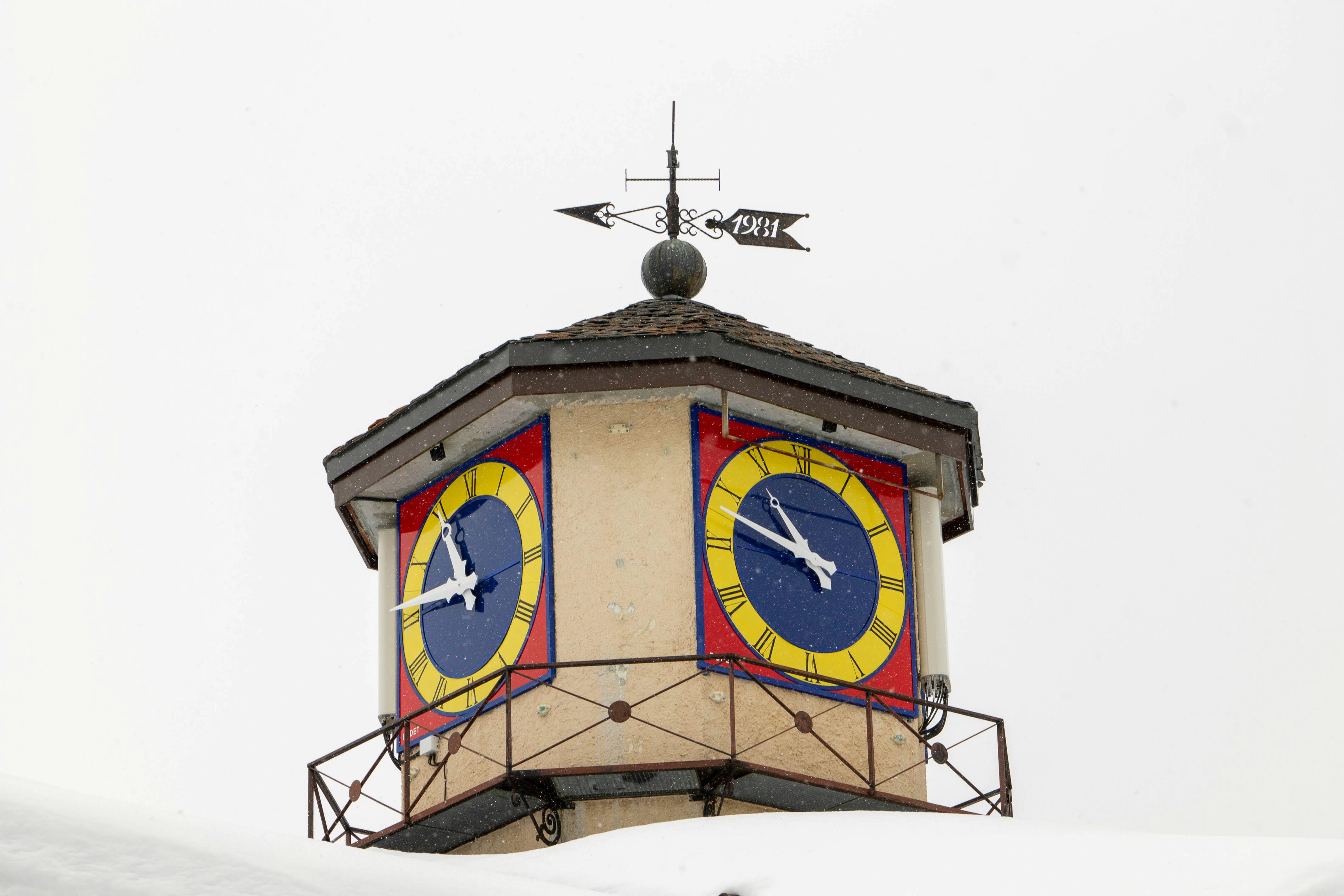 Snowbound Clocktower: Colors Against White Silence