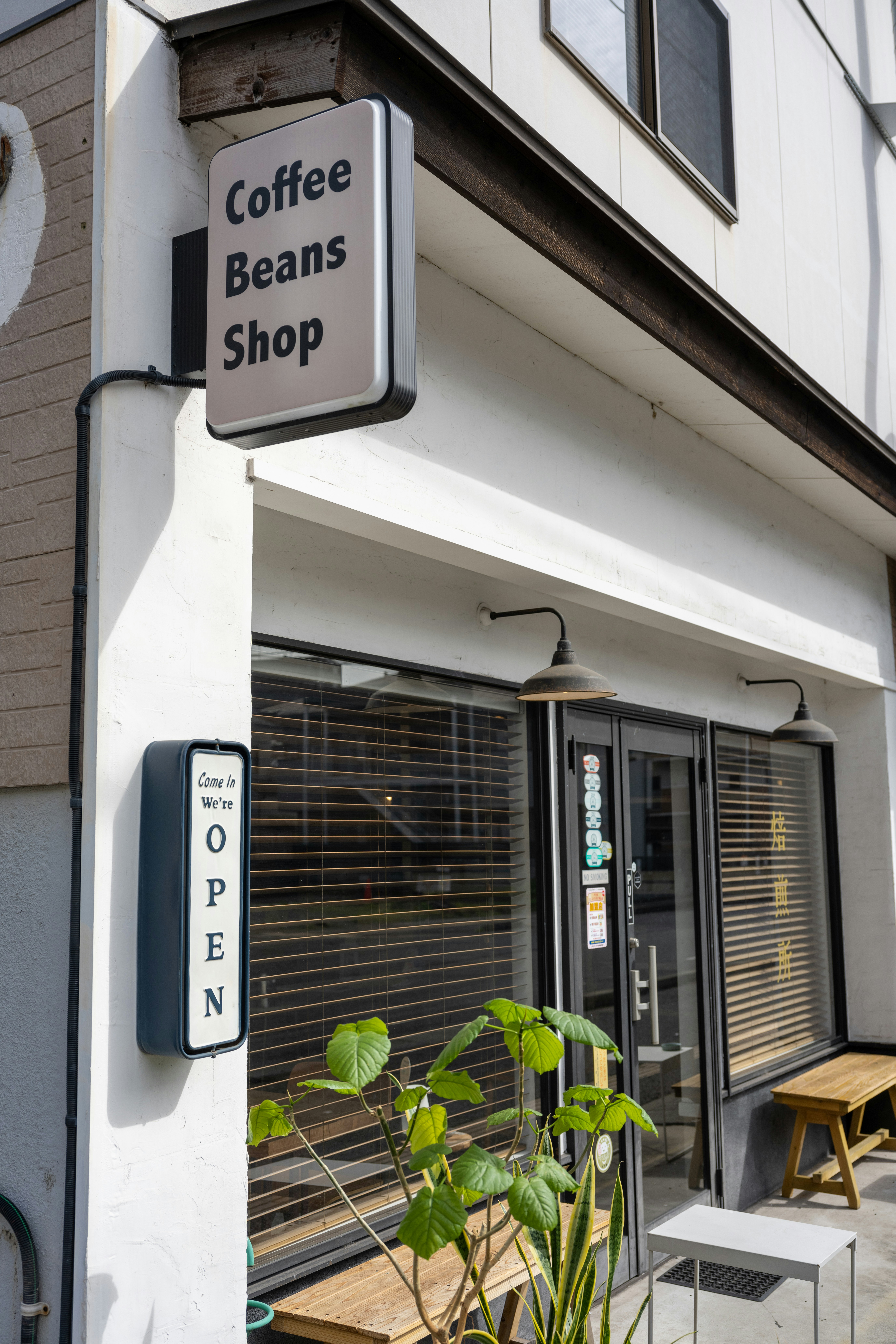 Open Signage Framing a Quiet Coffee Beans Shop Facade