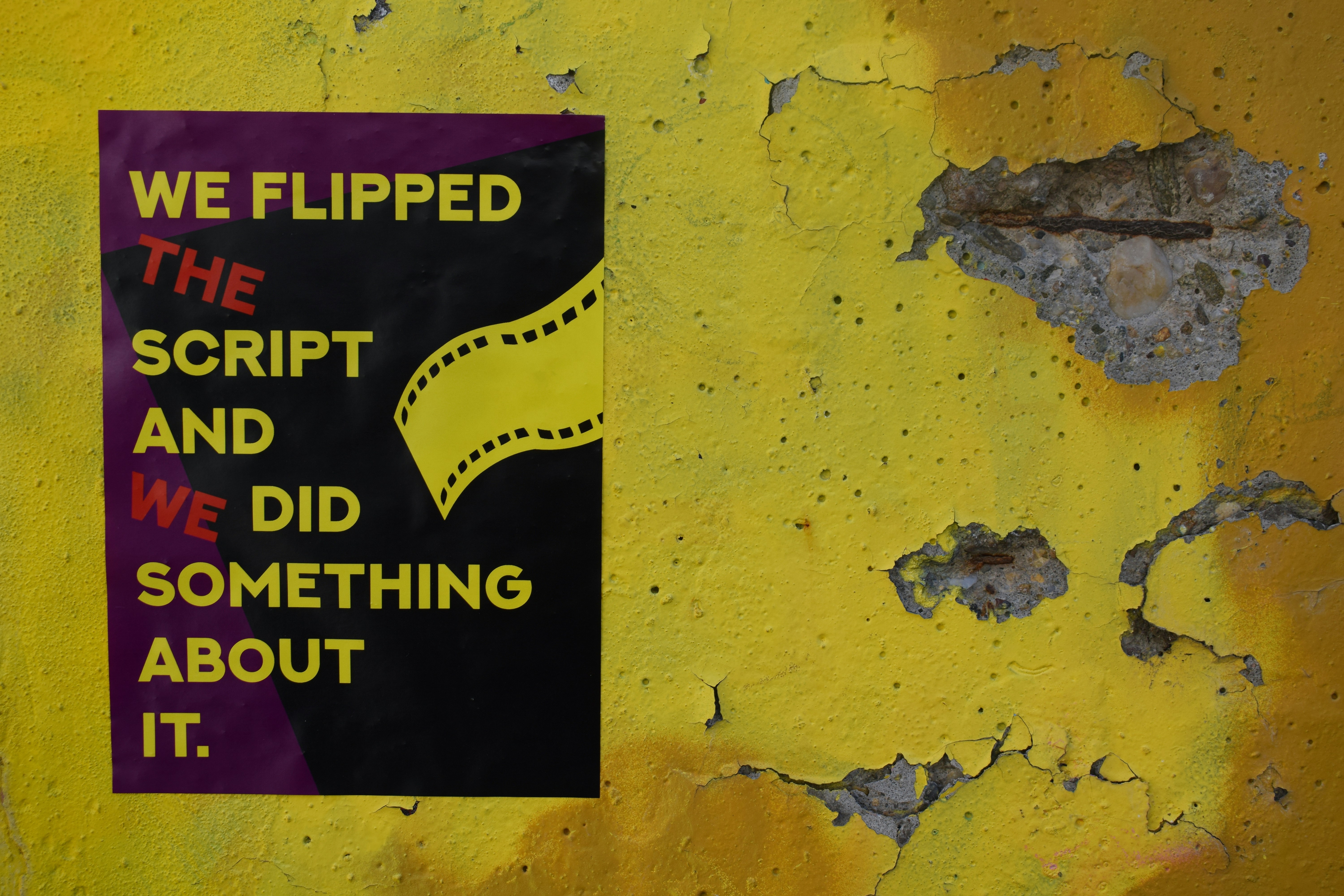 A sign on a yellow wall that says we flipped the script and we did ...