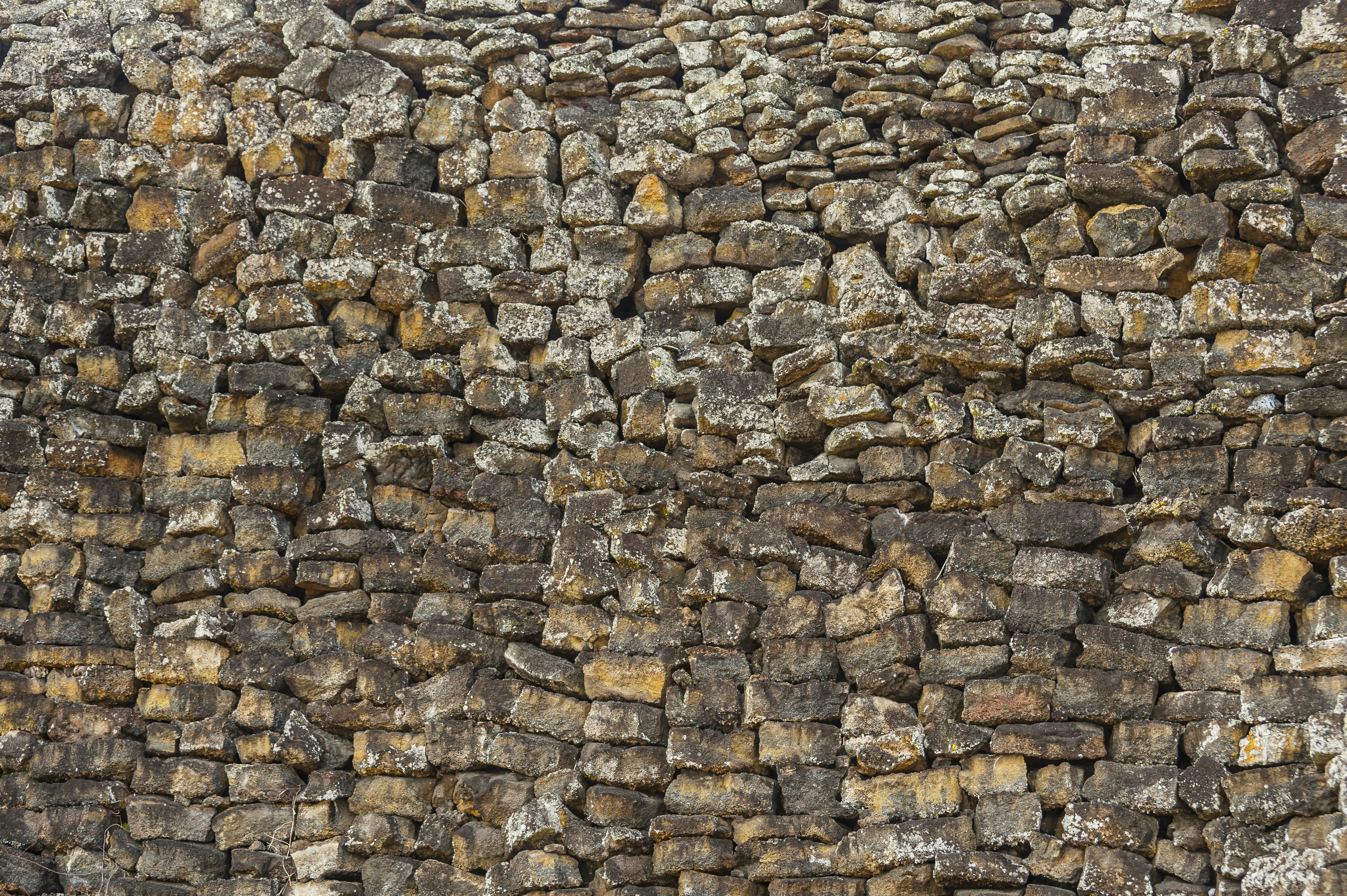 A stone wall made of rocks and cement photo – Free Ecuador Image on ...
