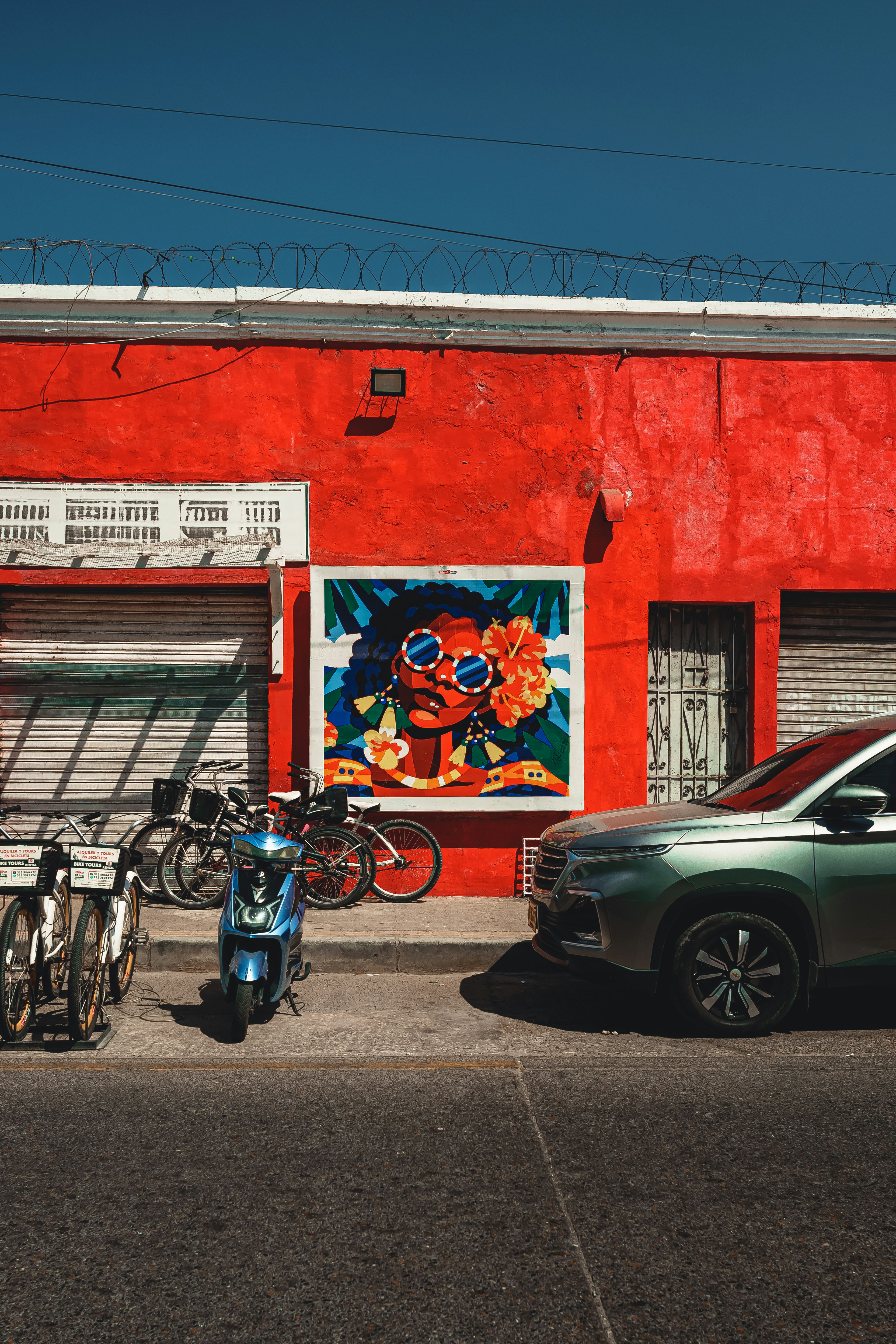 Crimson Facade and a Tropical Mural: Street Life in Color