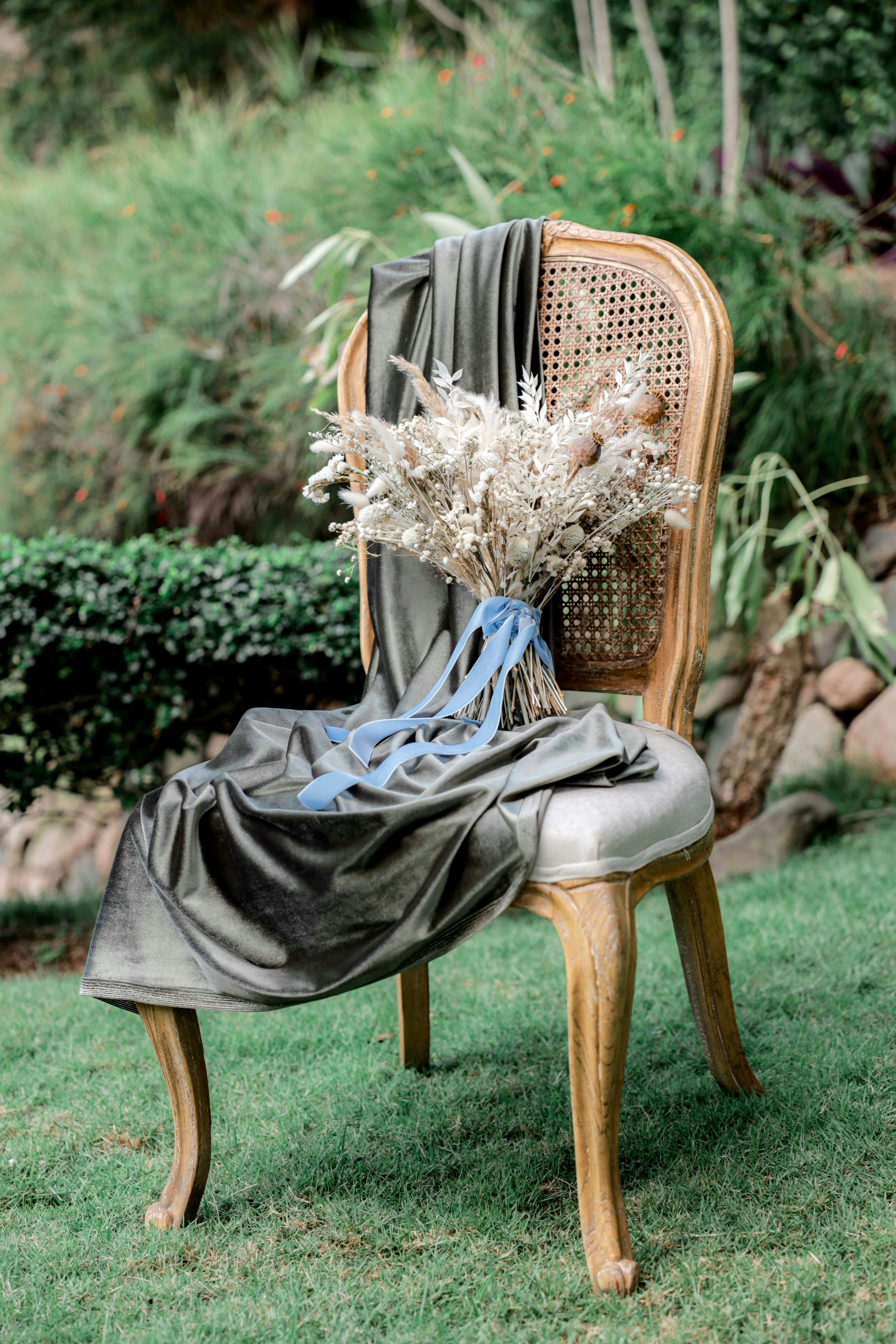 a chair with a black cloth draped over it