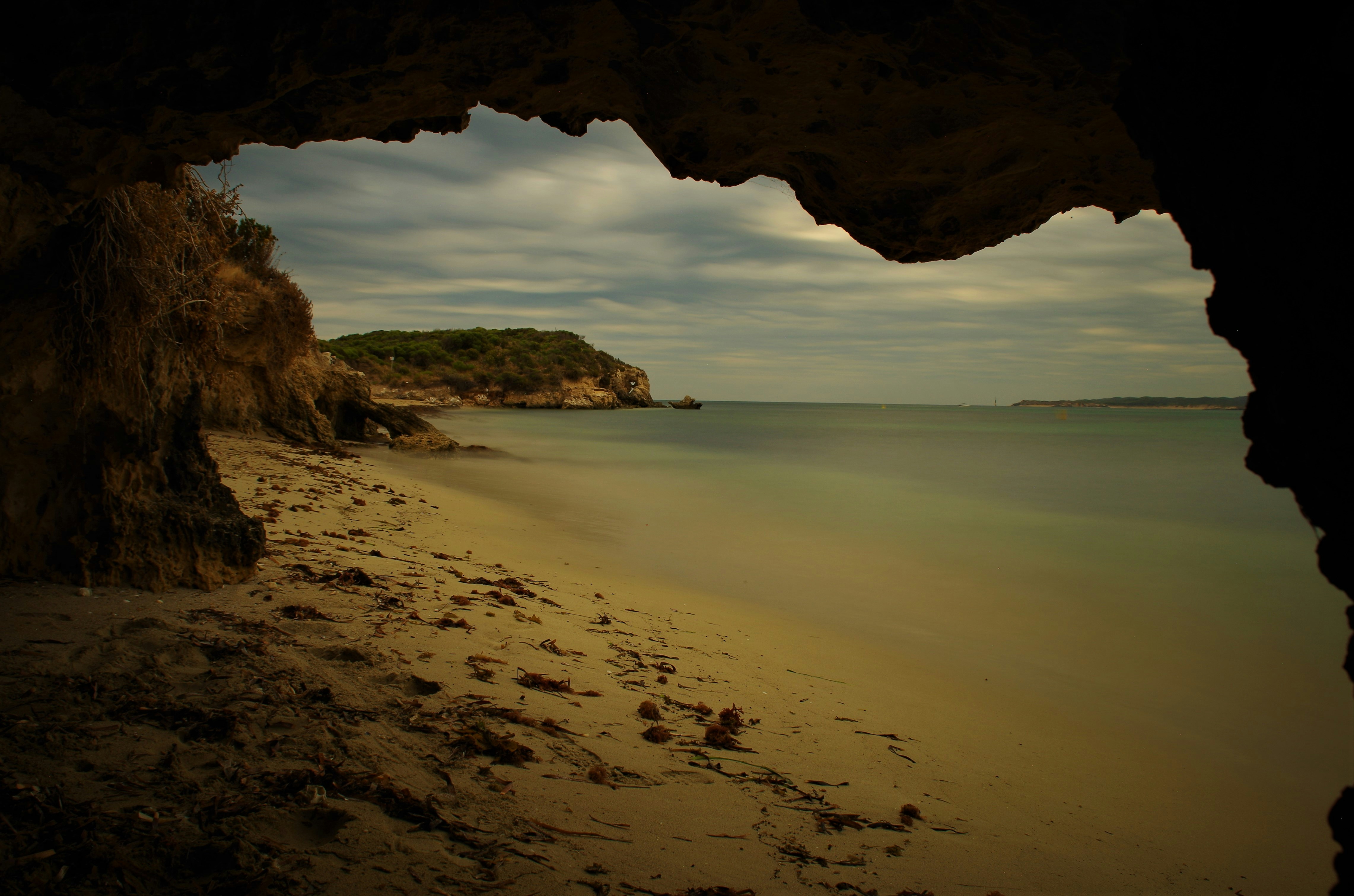 Cove Light: Golden Sand Fringed by a Quiet Sea