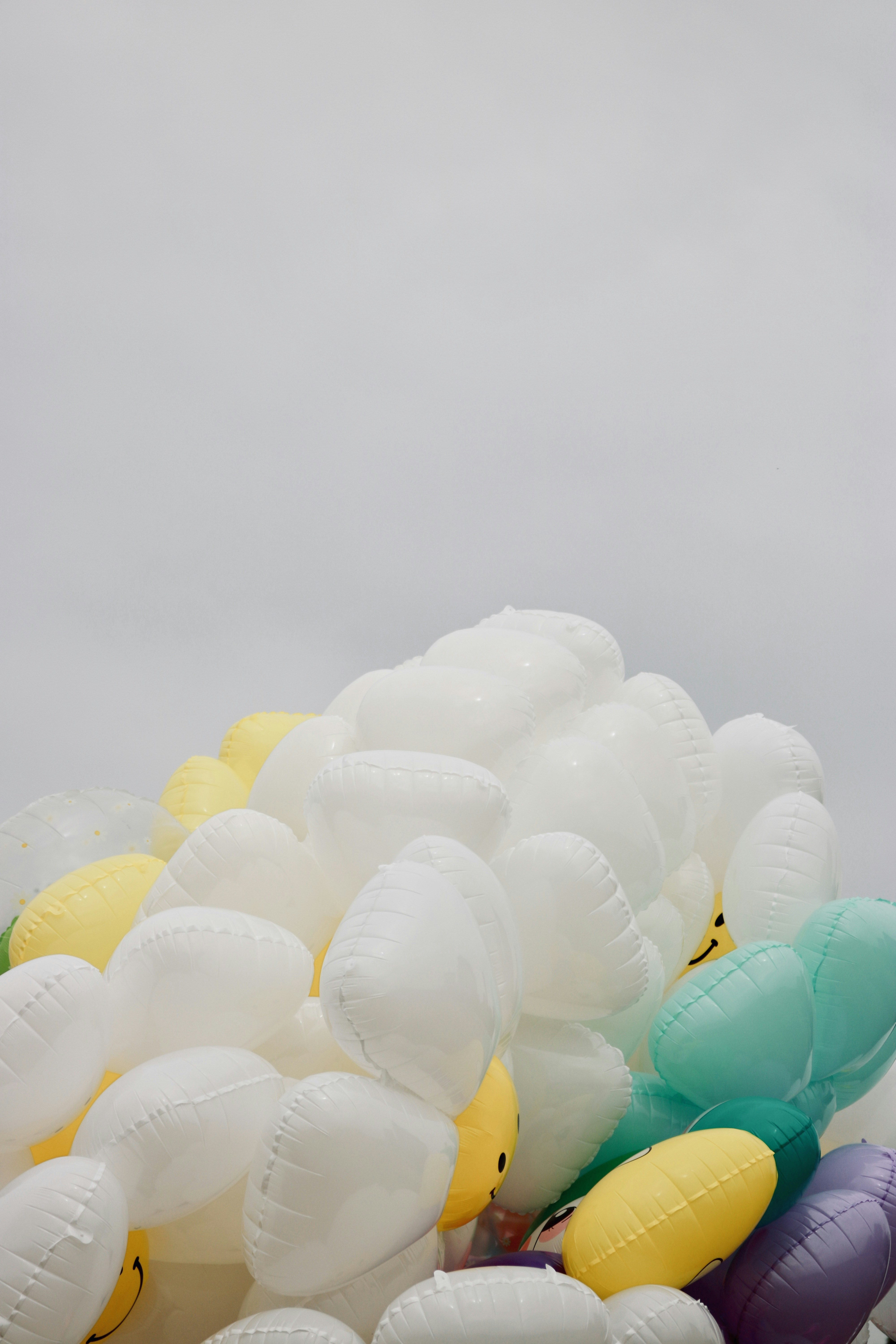 a bunch of balloons that are in the air