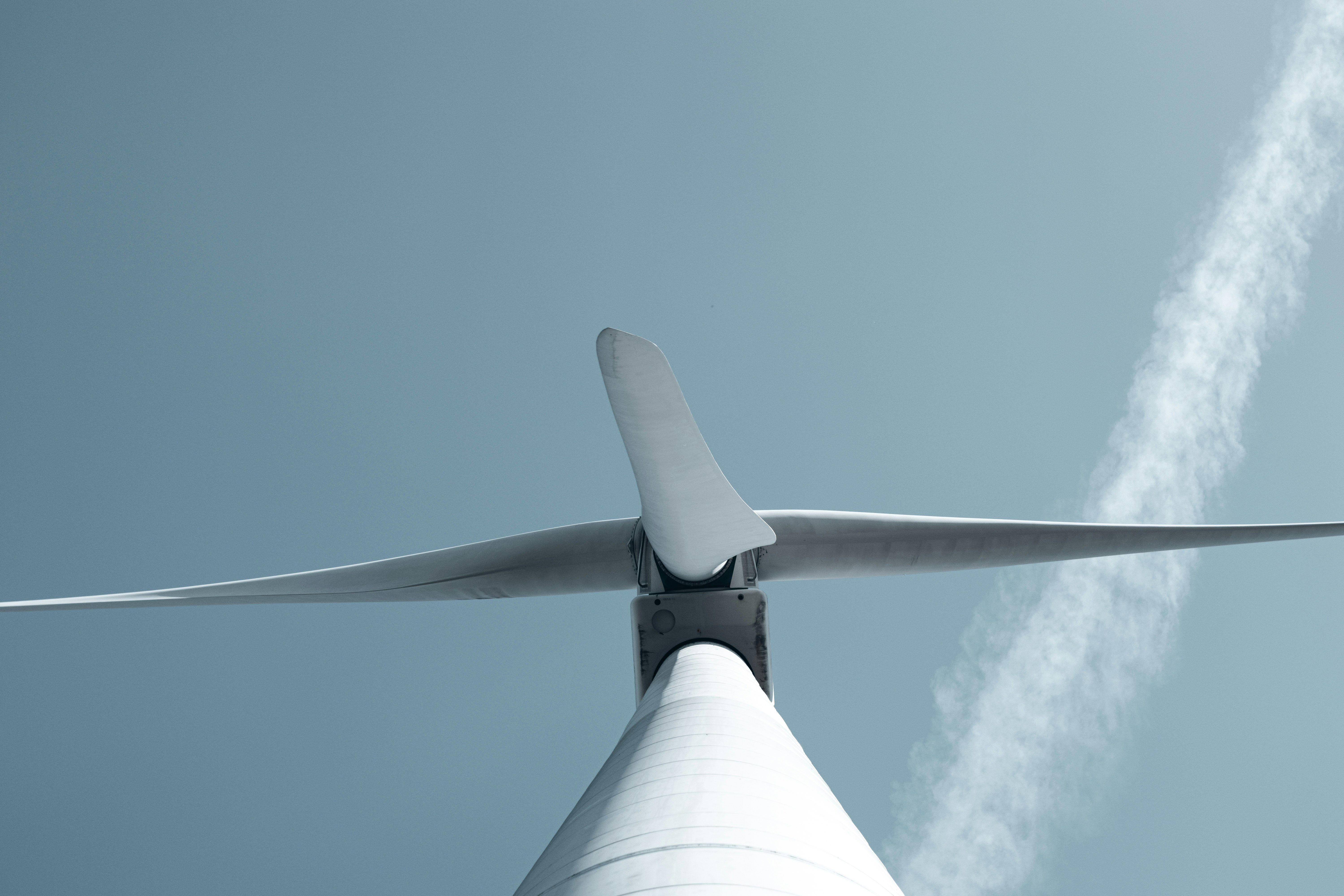 Vantage Point: Centered Turbine Mast with Wings Streaking Sky