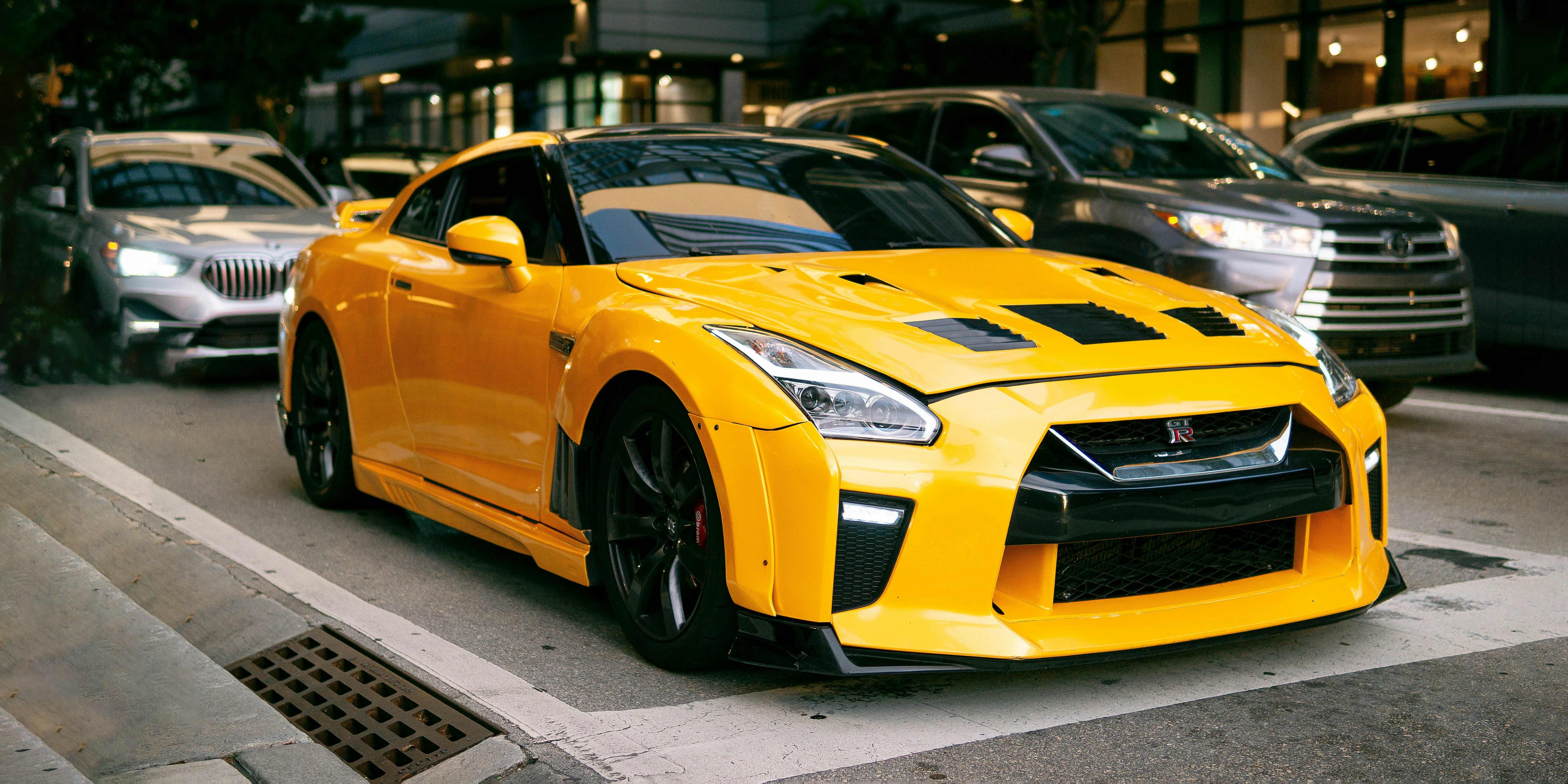 A yellow sports car parked on the side of the road photo – Free Gtr r35 ...