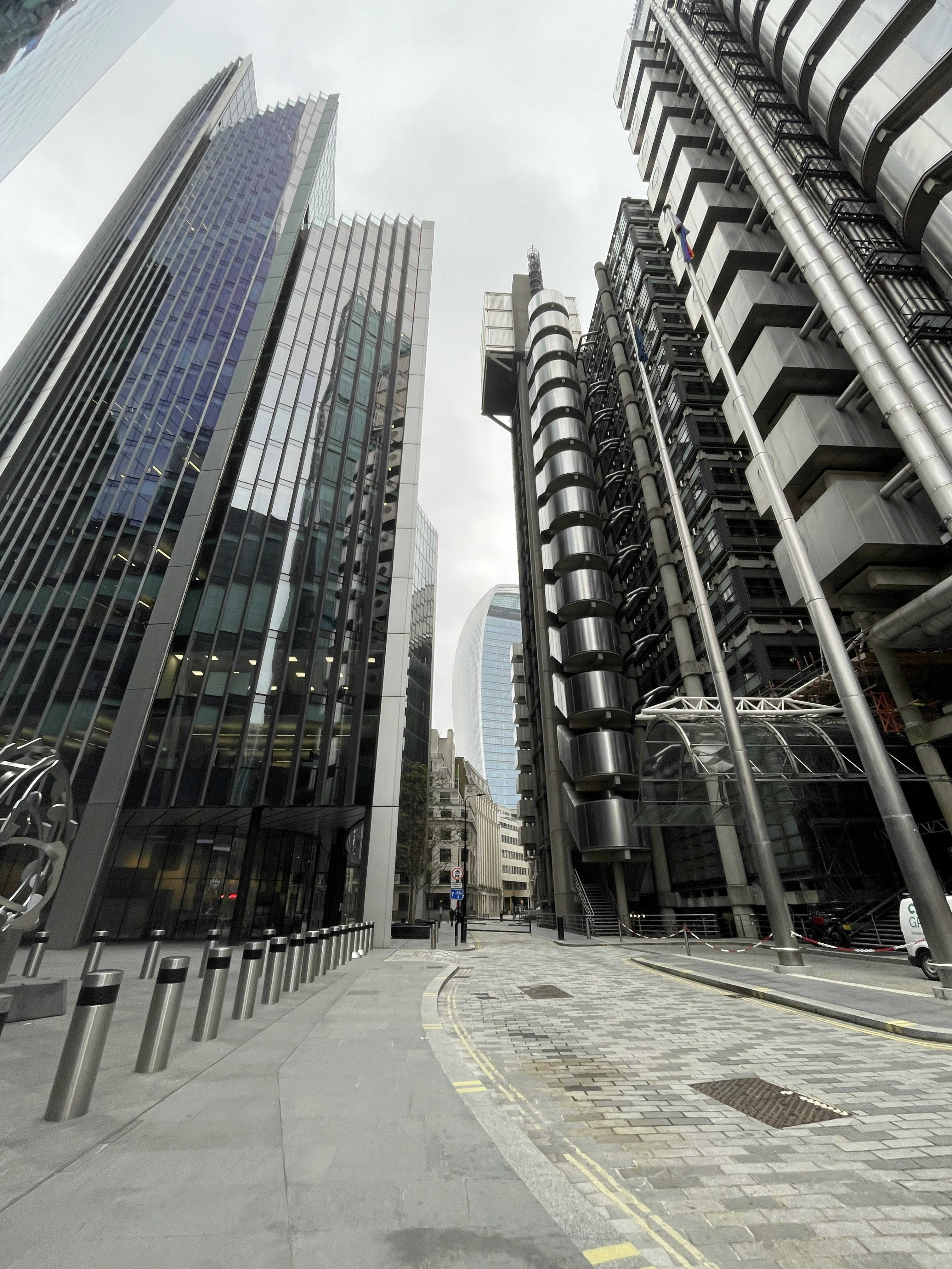 Between Glass Giants: A Street Runs Through a Steel Canyon
