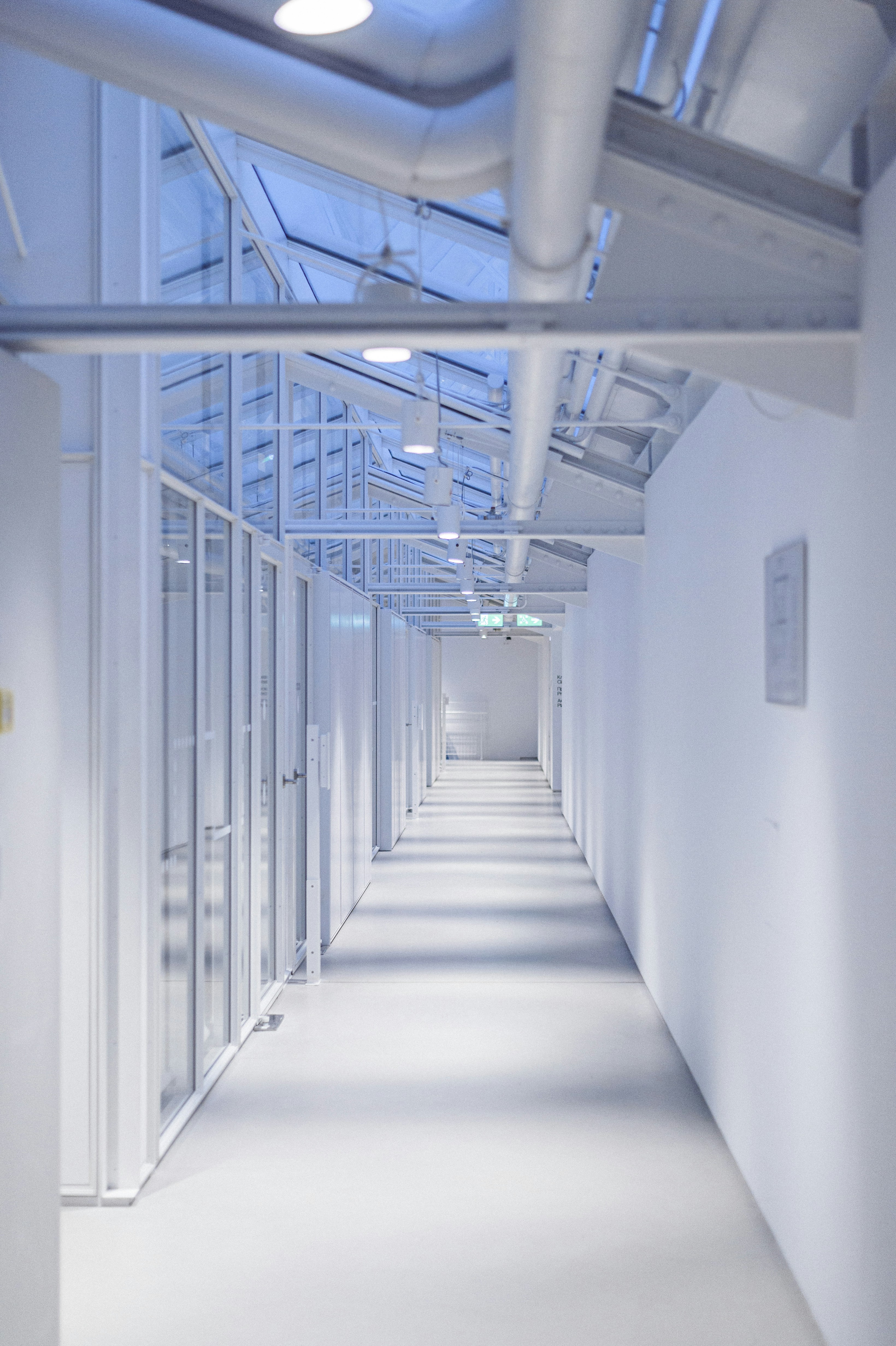 A long white hallway with lots of windows photo – Free Гэс-2 Image on ...
