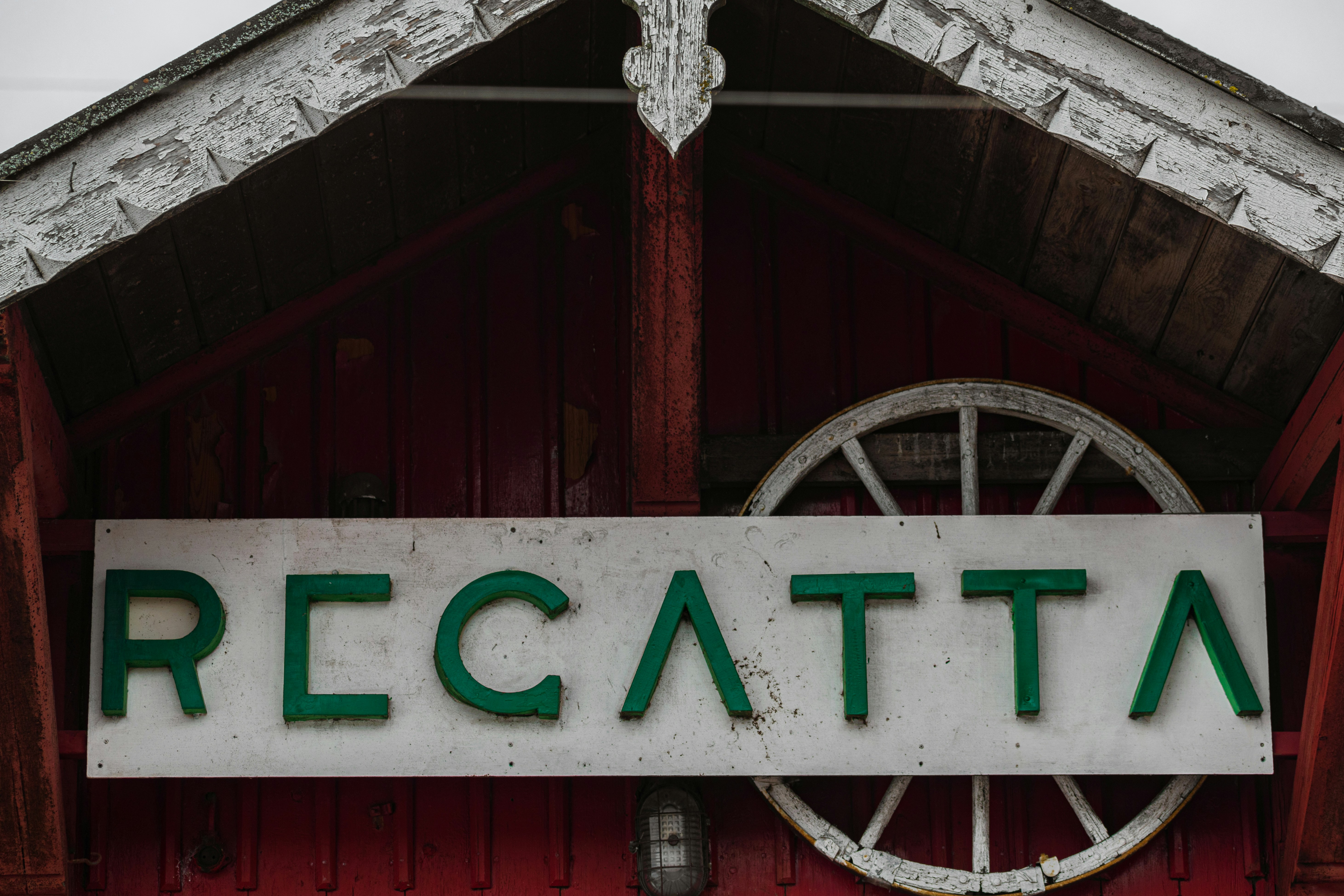 A sign that is on the side of a building photo – Free Regatta Image on ...