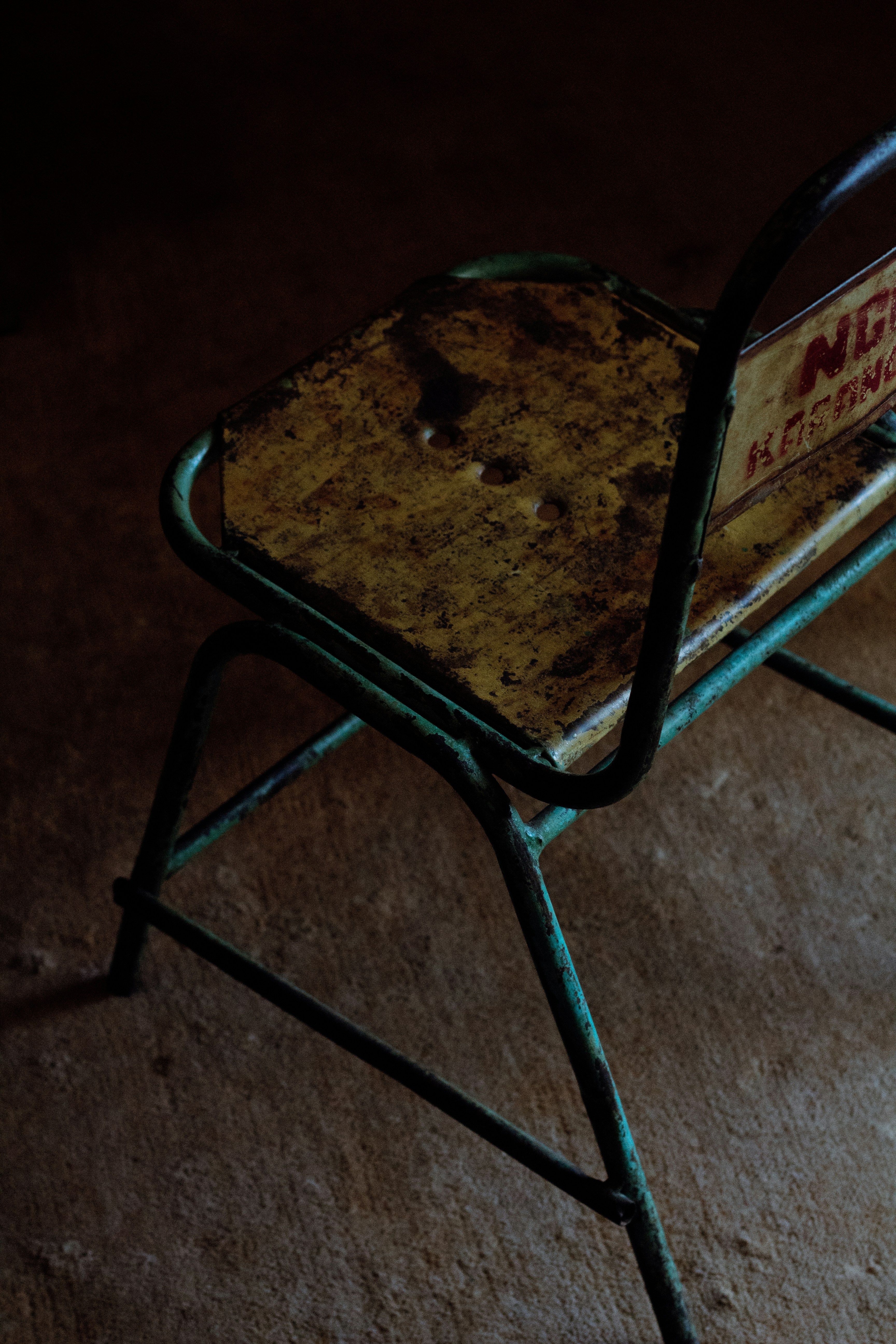 Rust and Remnants: a Tilted Seat in a Dusty Room