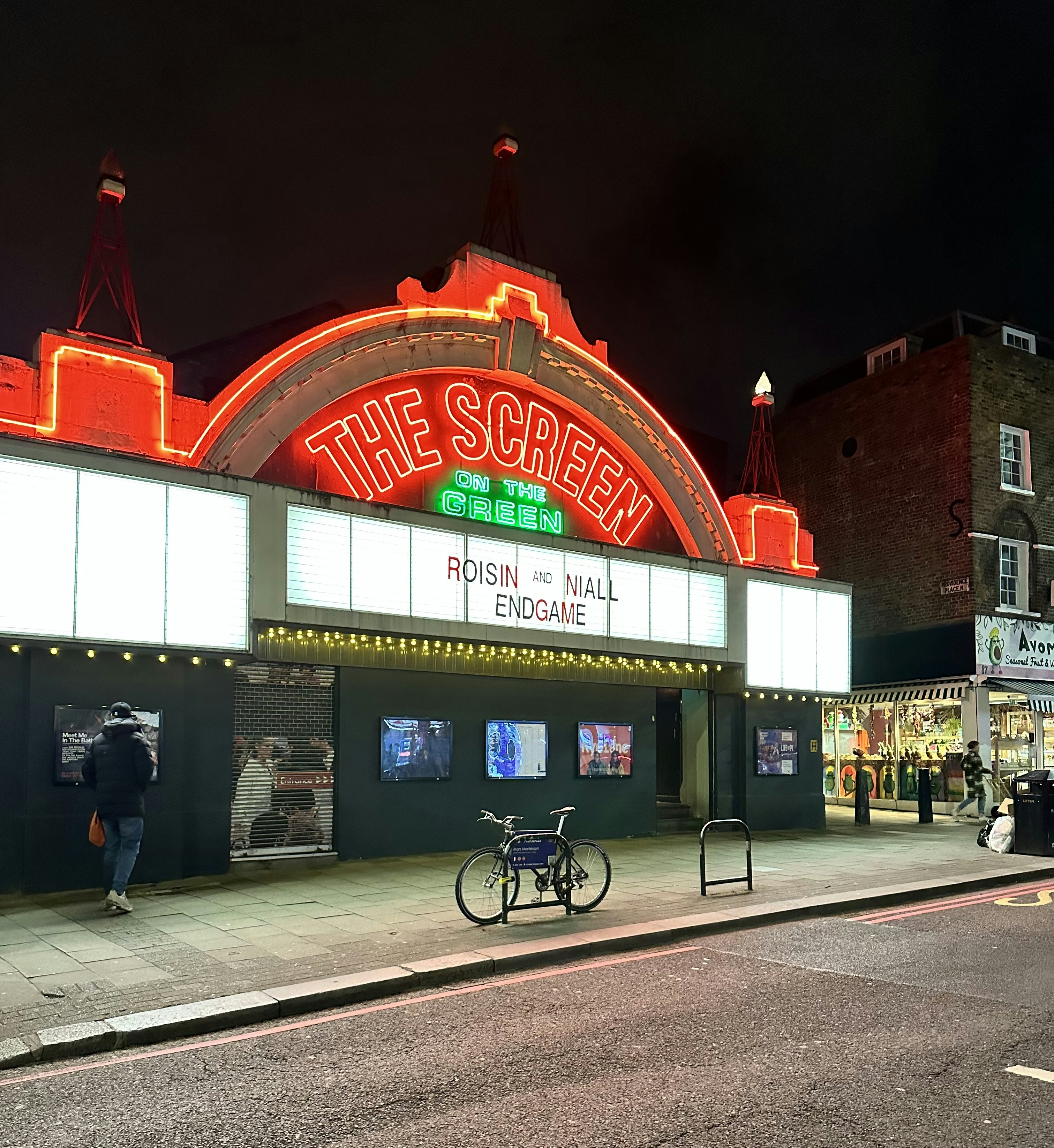 Neon Signage and The Screen: Night at a Classic Cinema