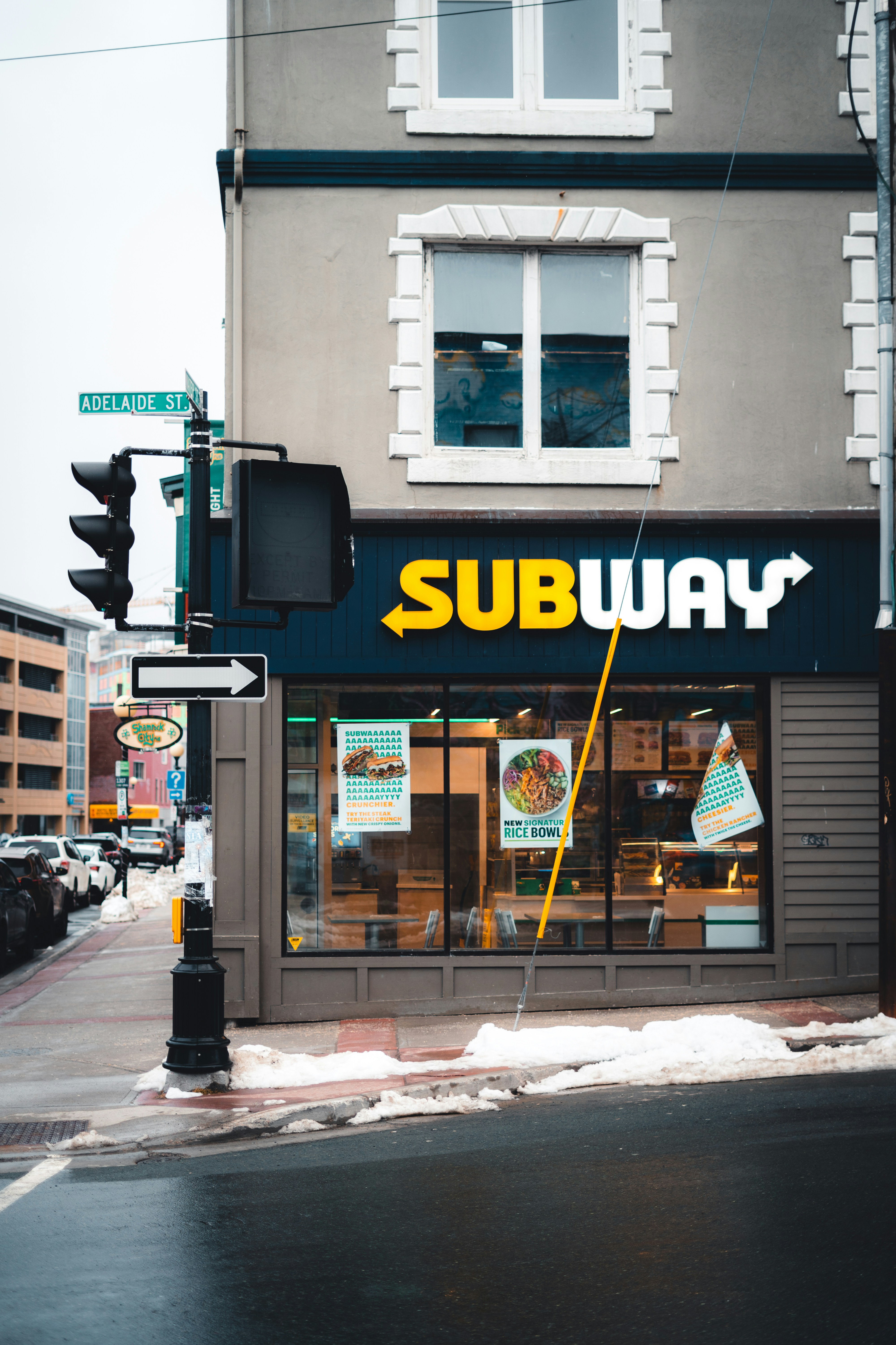 A subway restaurant on a city street corner photo – Free City Image on ...