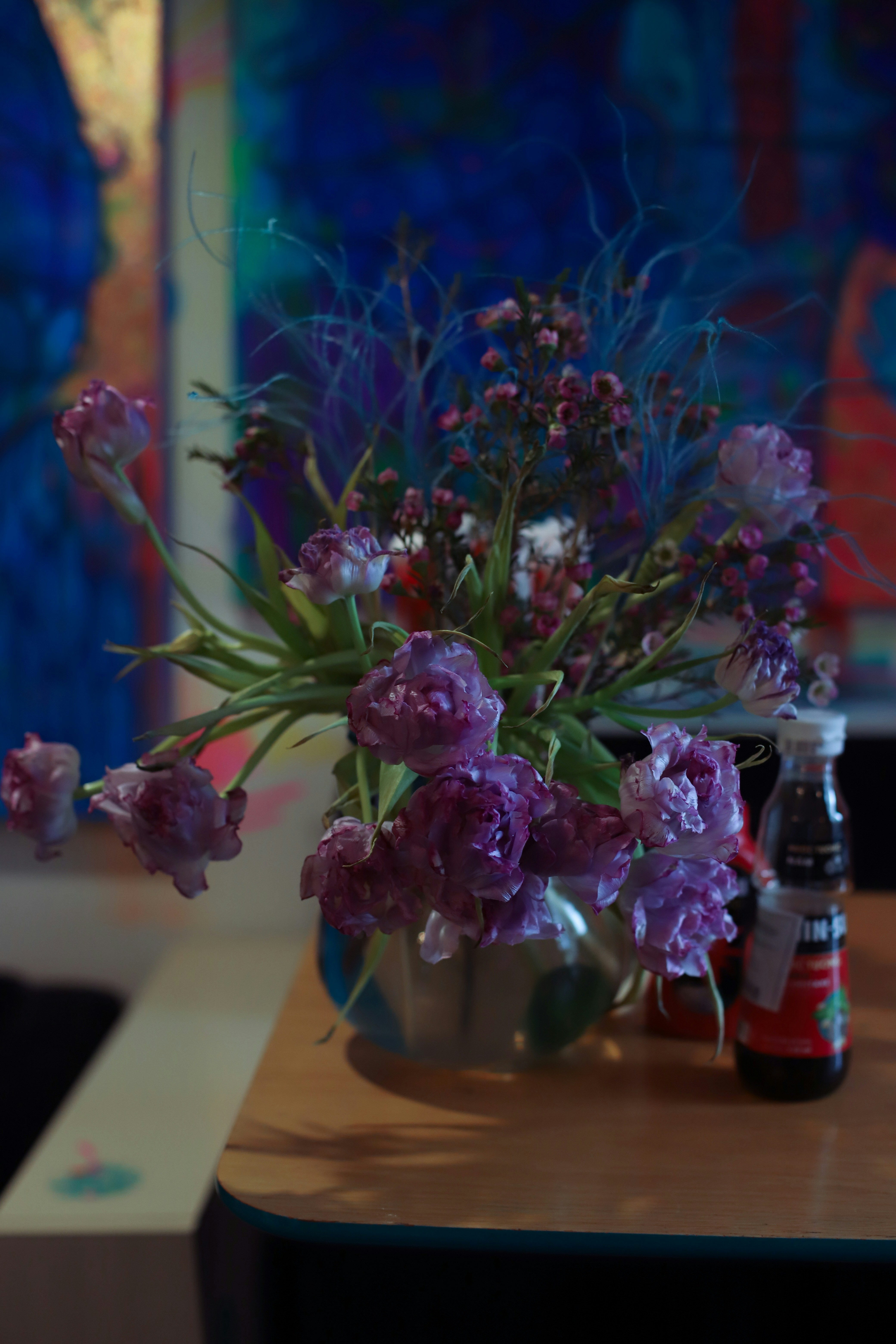 Violet Bouquet on a Wooden Table with Dark Studio Lighting