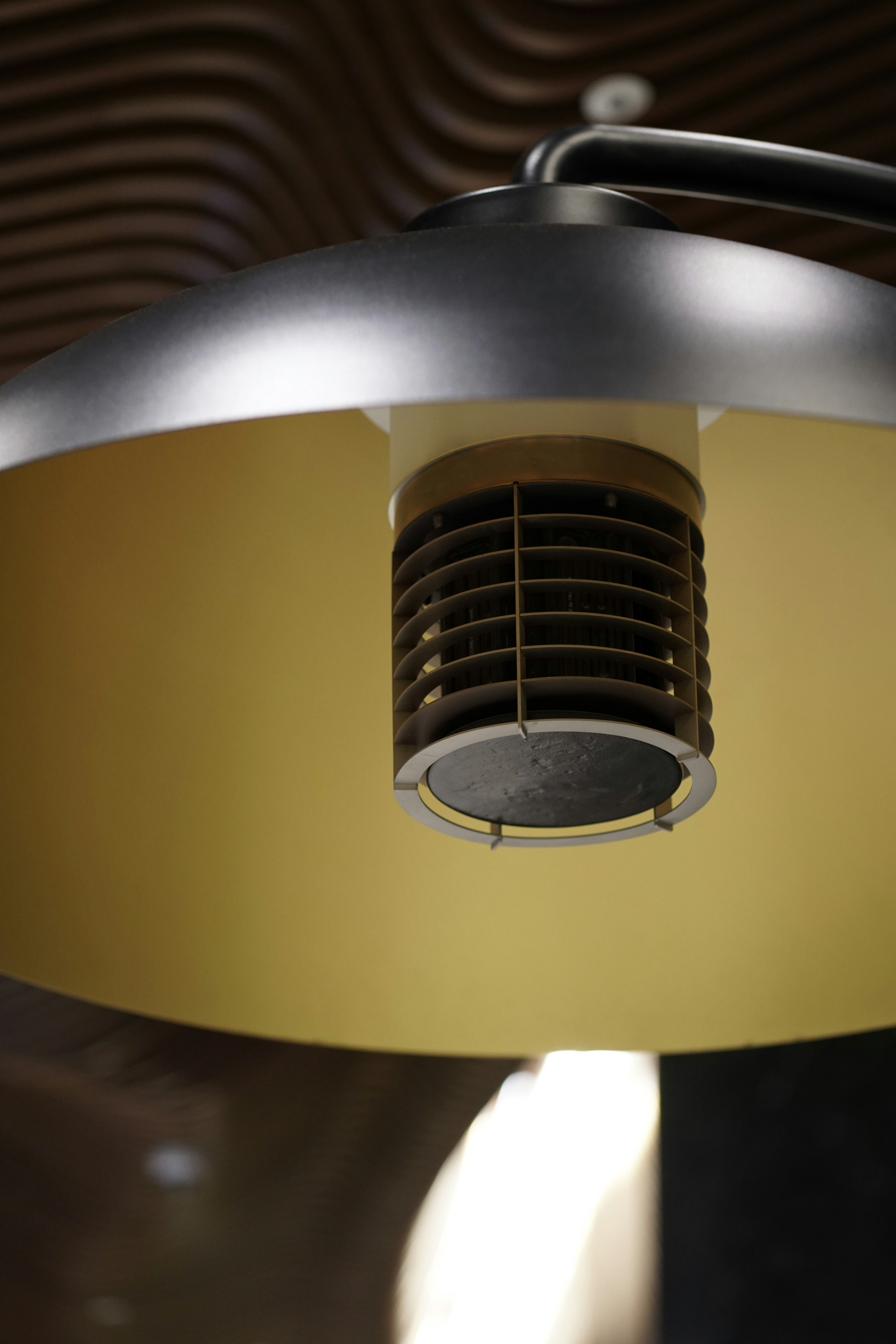 a close up of a light fixture with a fan