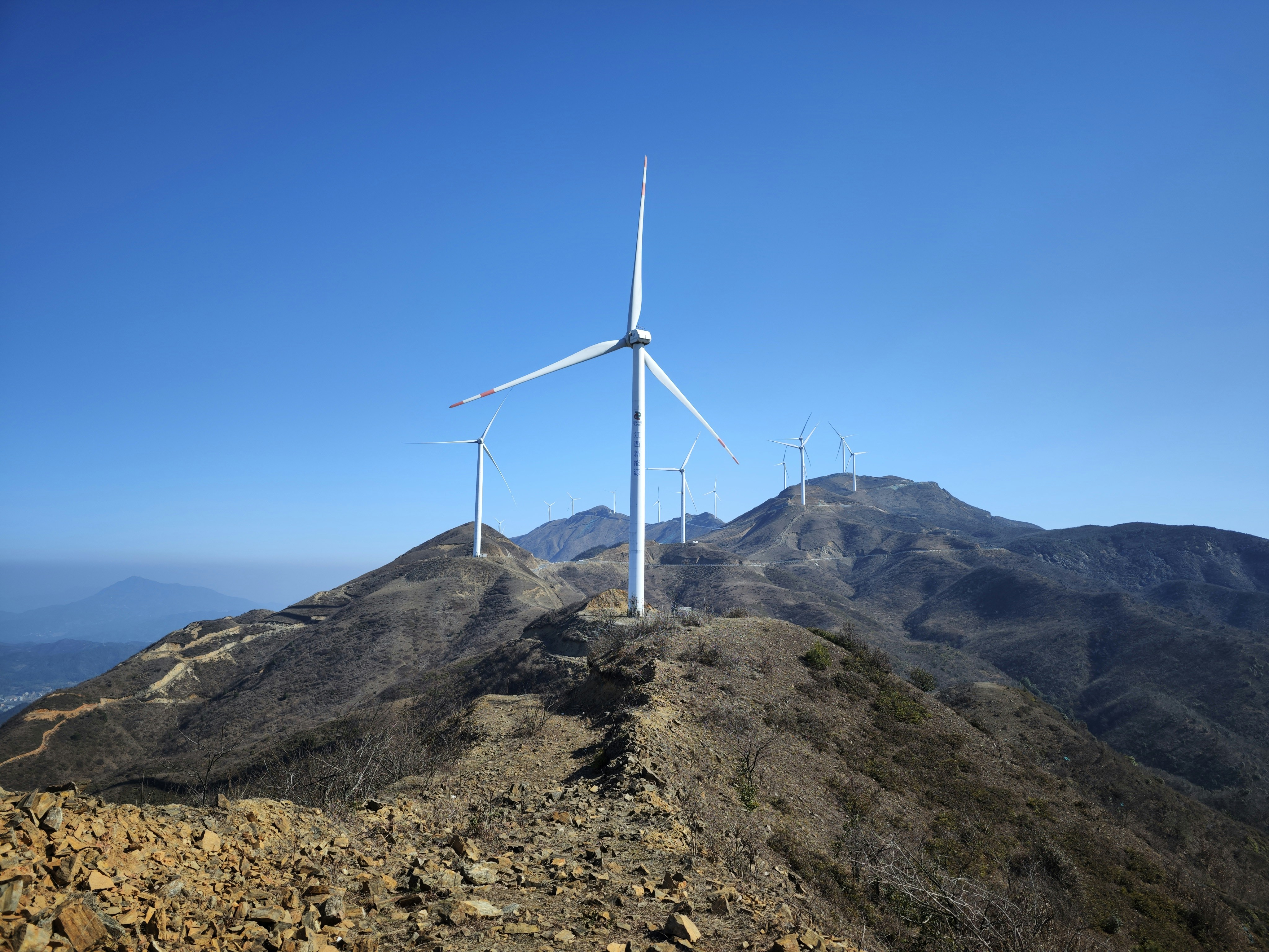 A group of wind turbines on top of a mountain photo – Free Ji'an Image ...