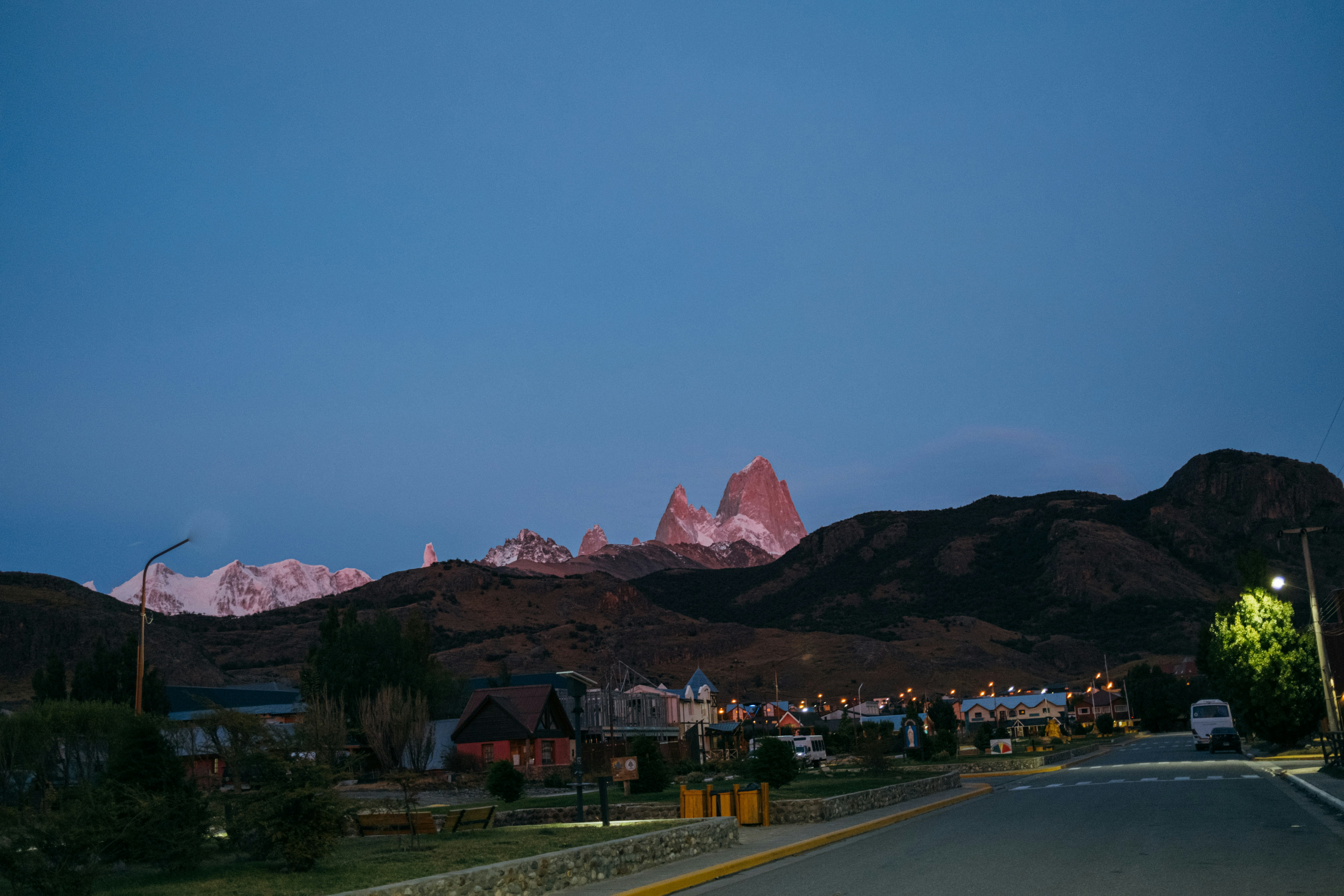 Blue-hour silhouettes over a quiet mountain town