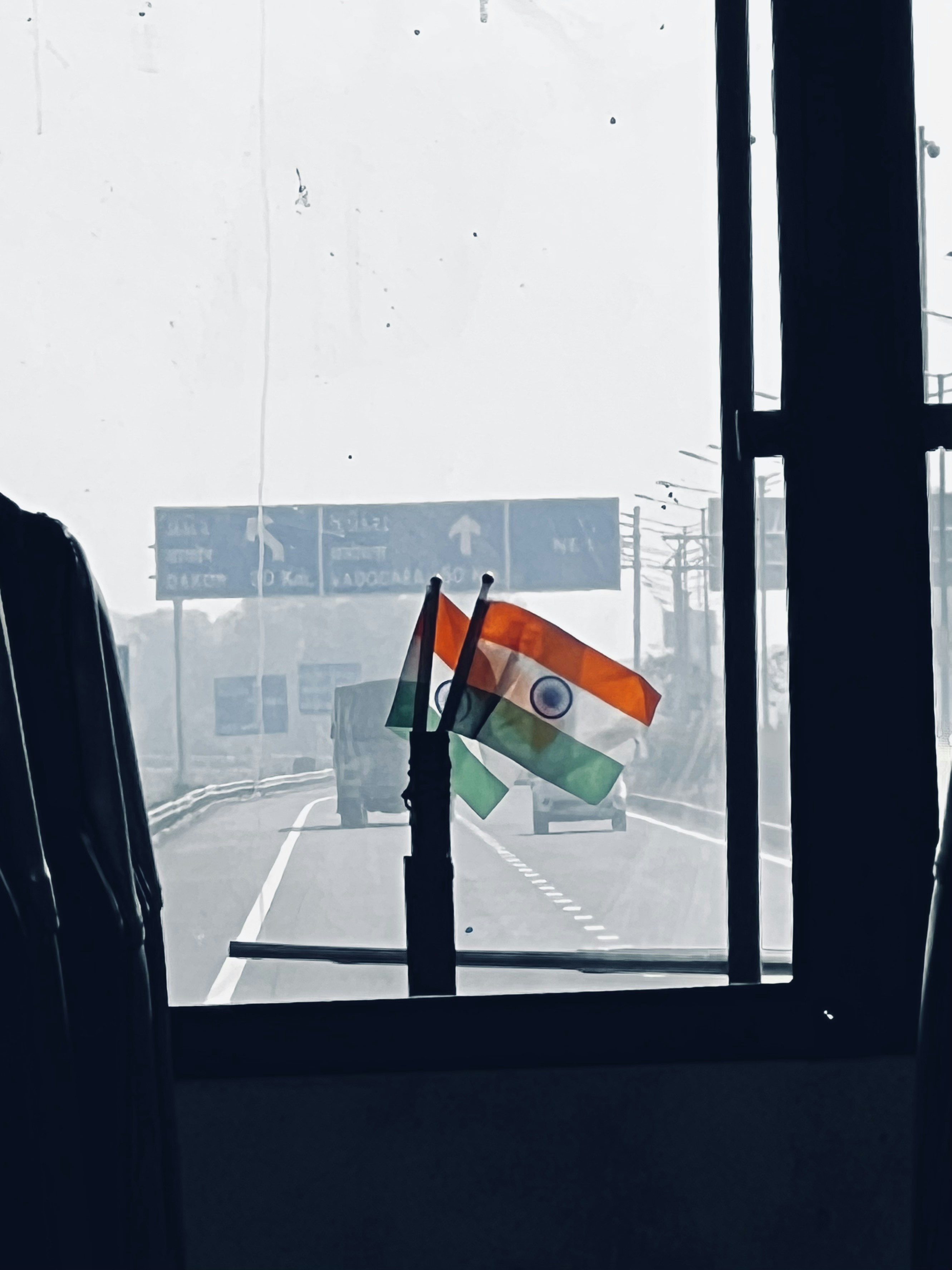 A view of the indian flag from a bus window photo – Free India Image on ...