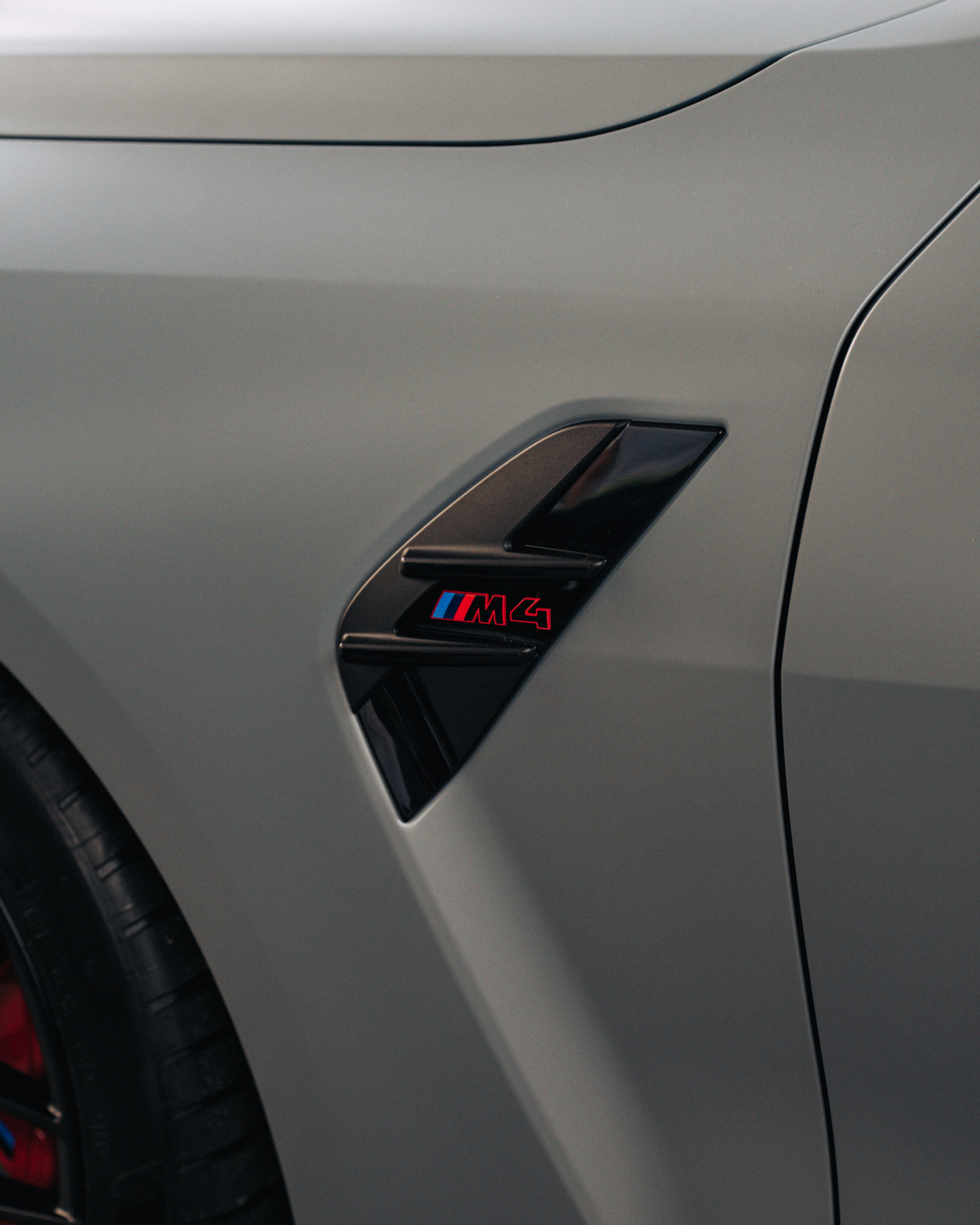 The Essence of Performance: BMW M4 Emblem Detail
