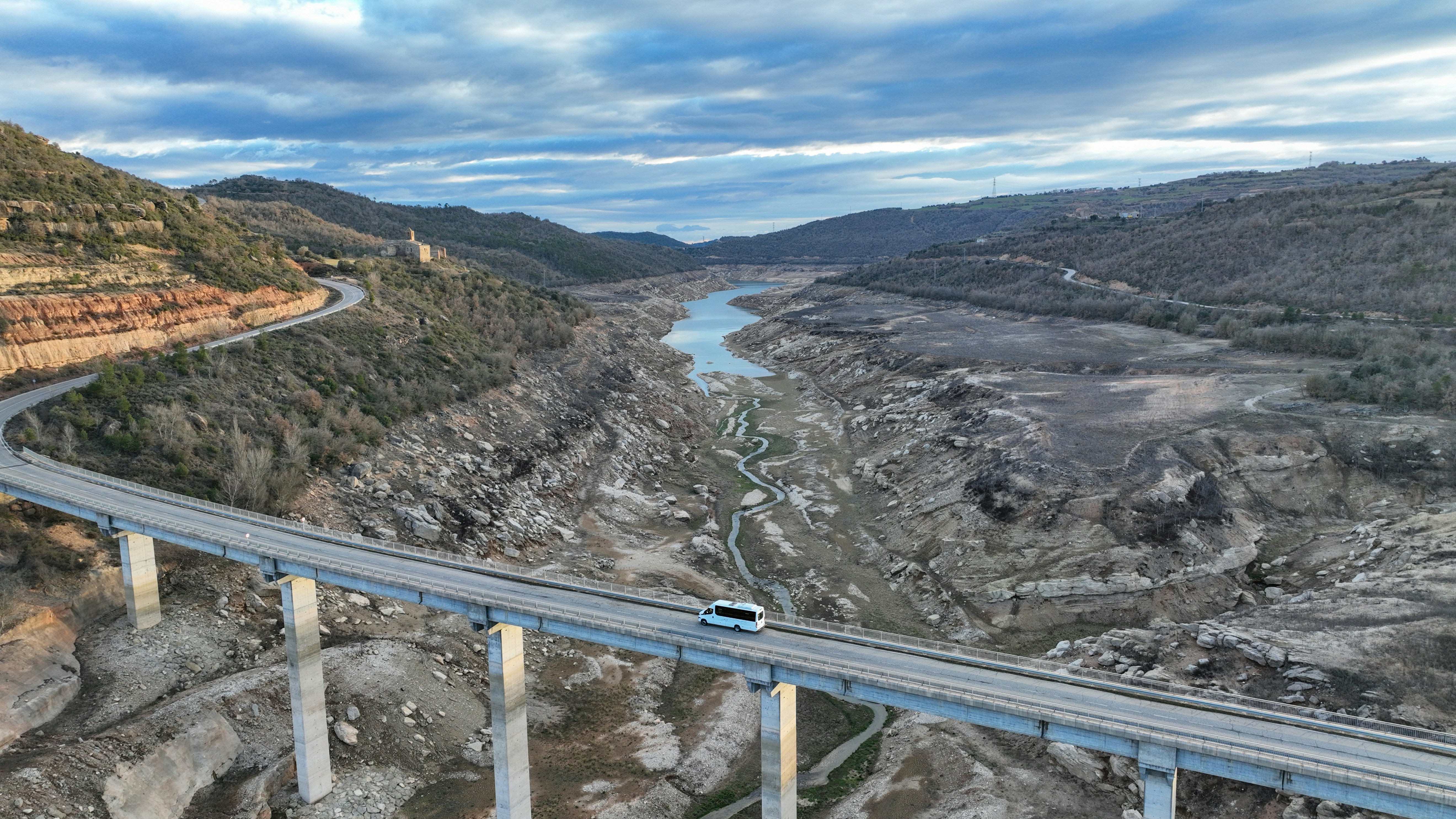 A car driving over a bridge over a river photo – Free Outdoors Image on ...