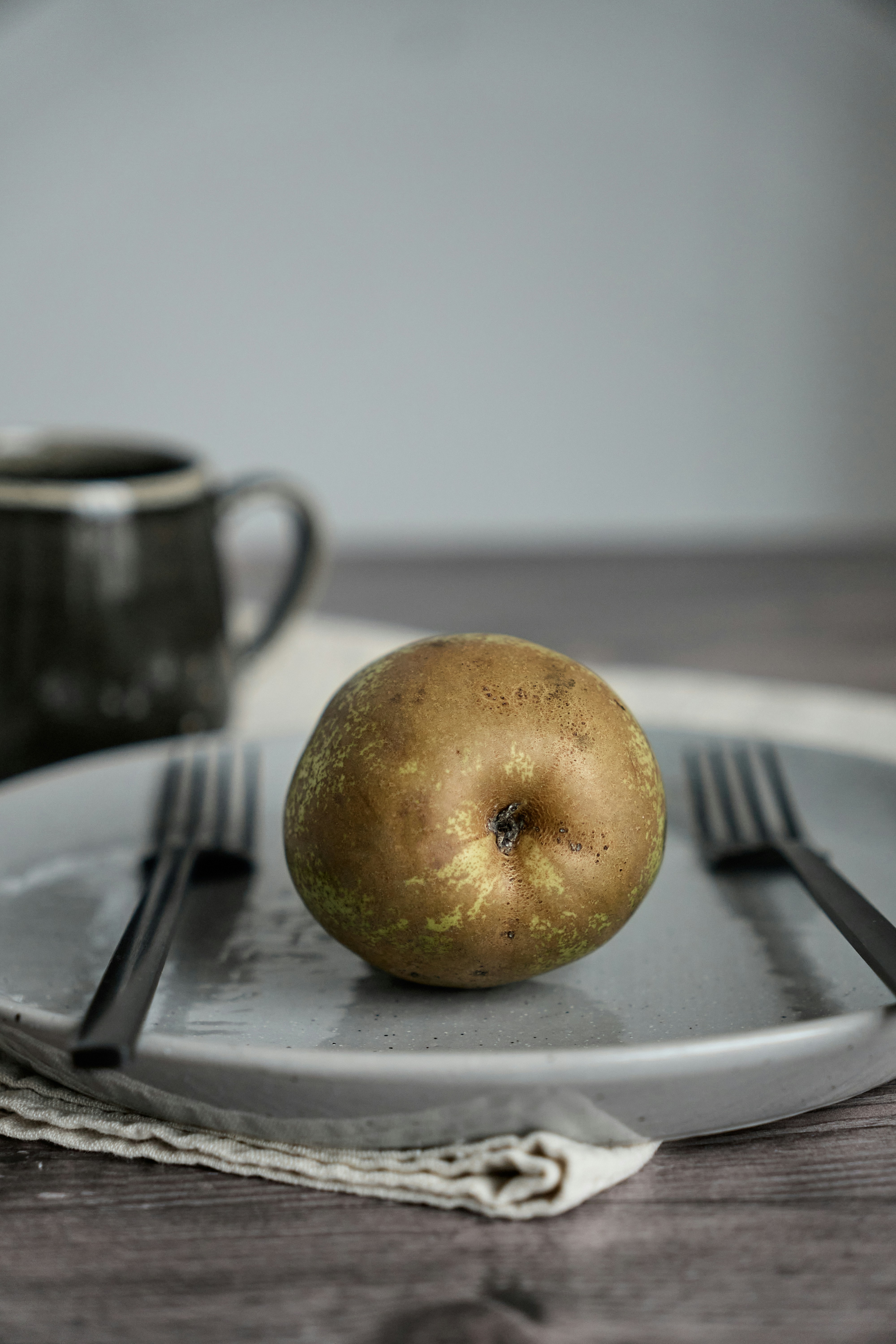 Pear on a Plate: Quiet Geometry and Soft Morning Light