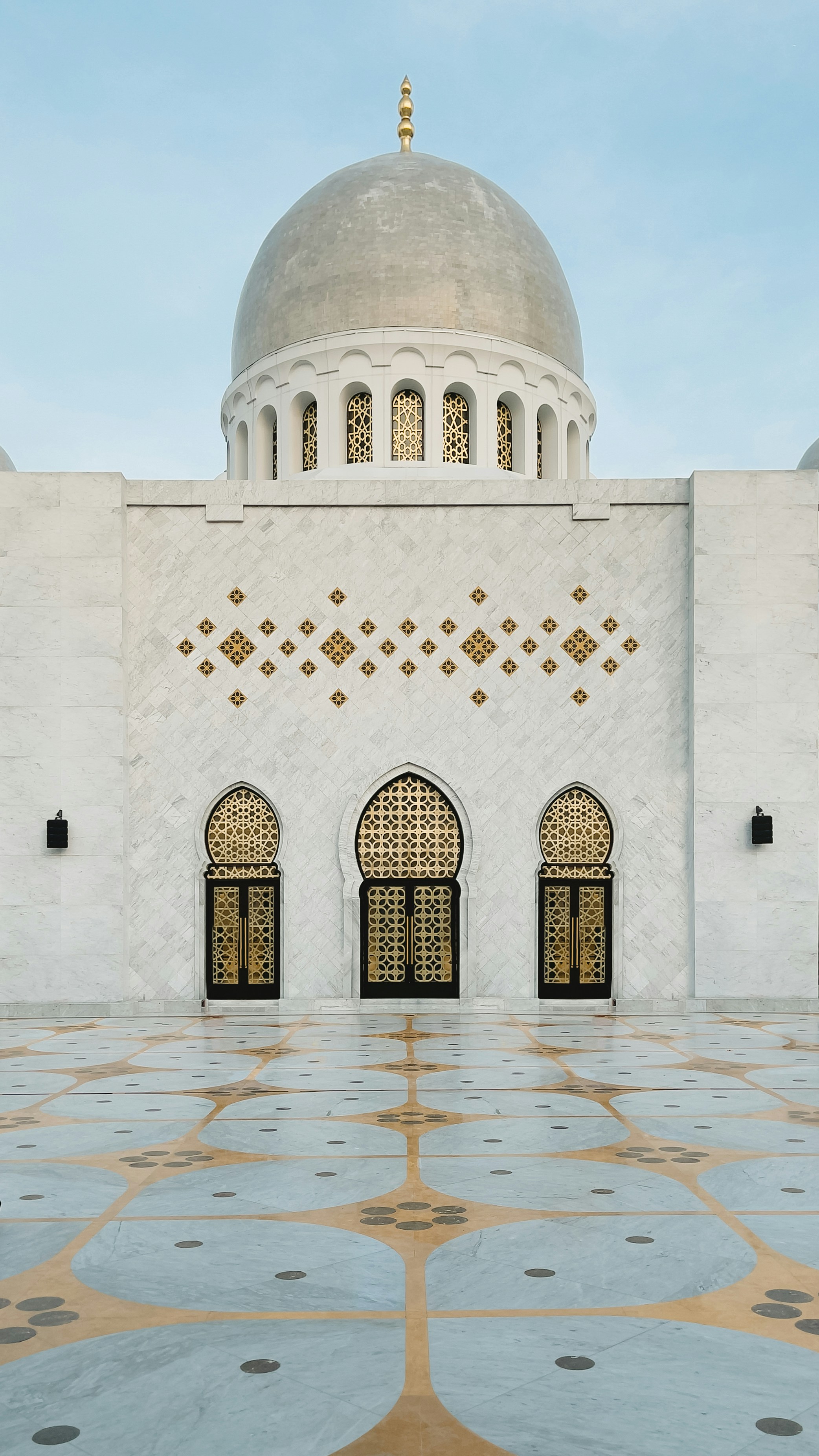 Granite Dome and Gold Lattice: Quiet Majesty of a Mosque Courtyard
