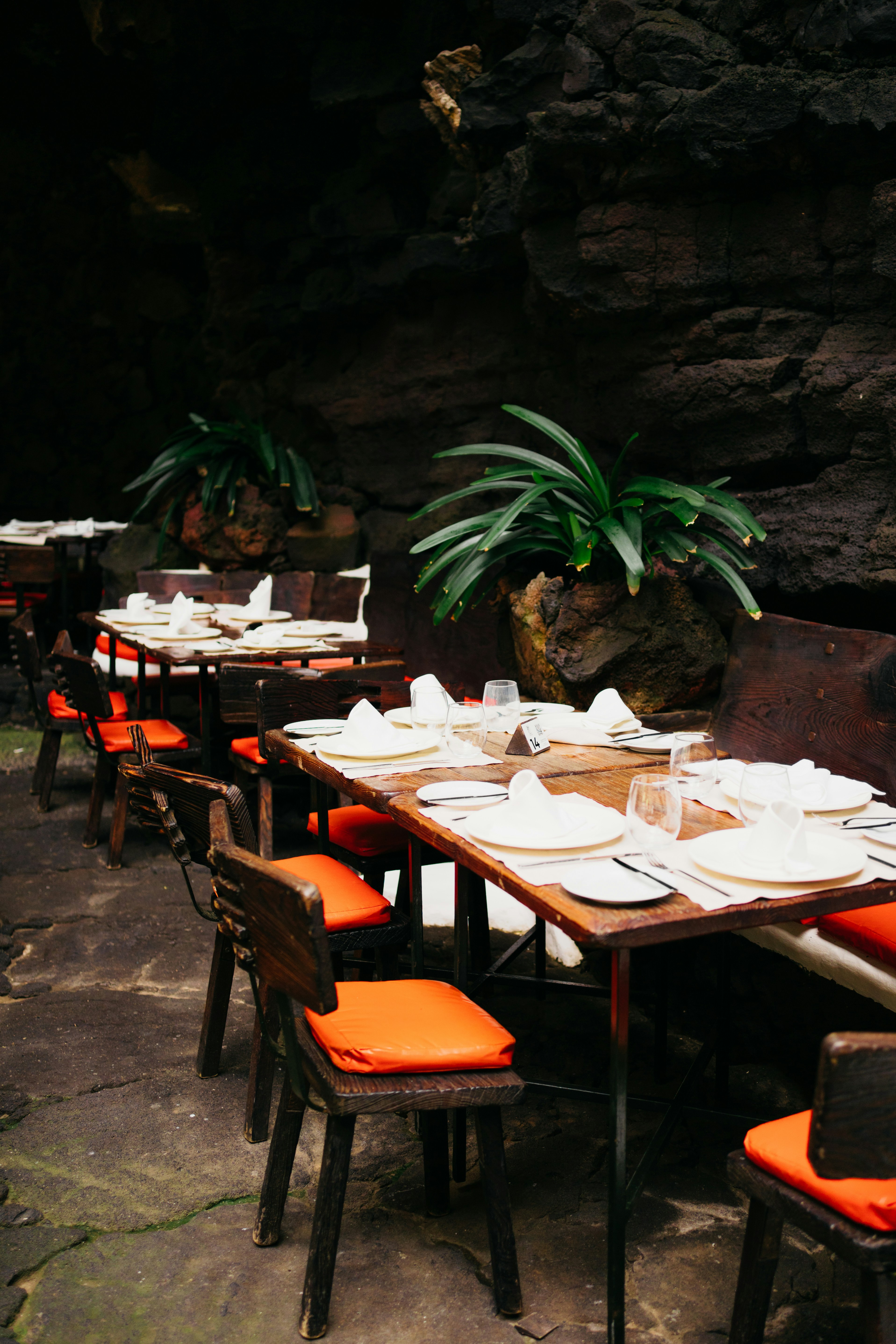 Rock-Walled Table for Two: Dining in an Alcove of Stone and Green