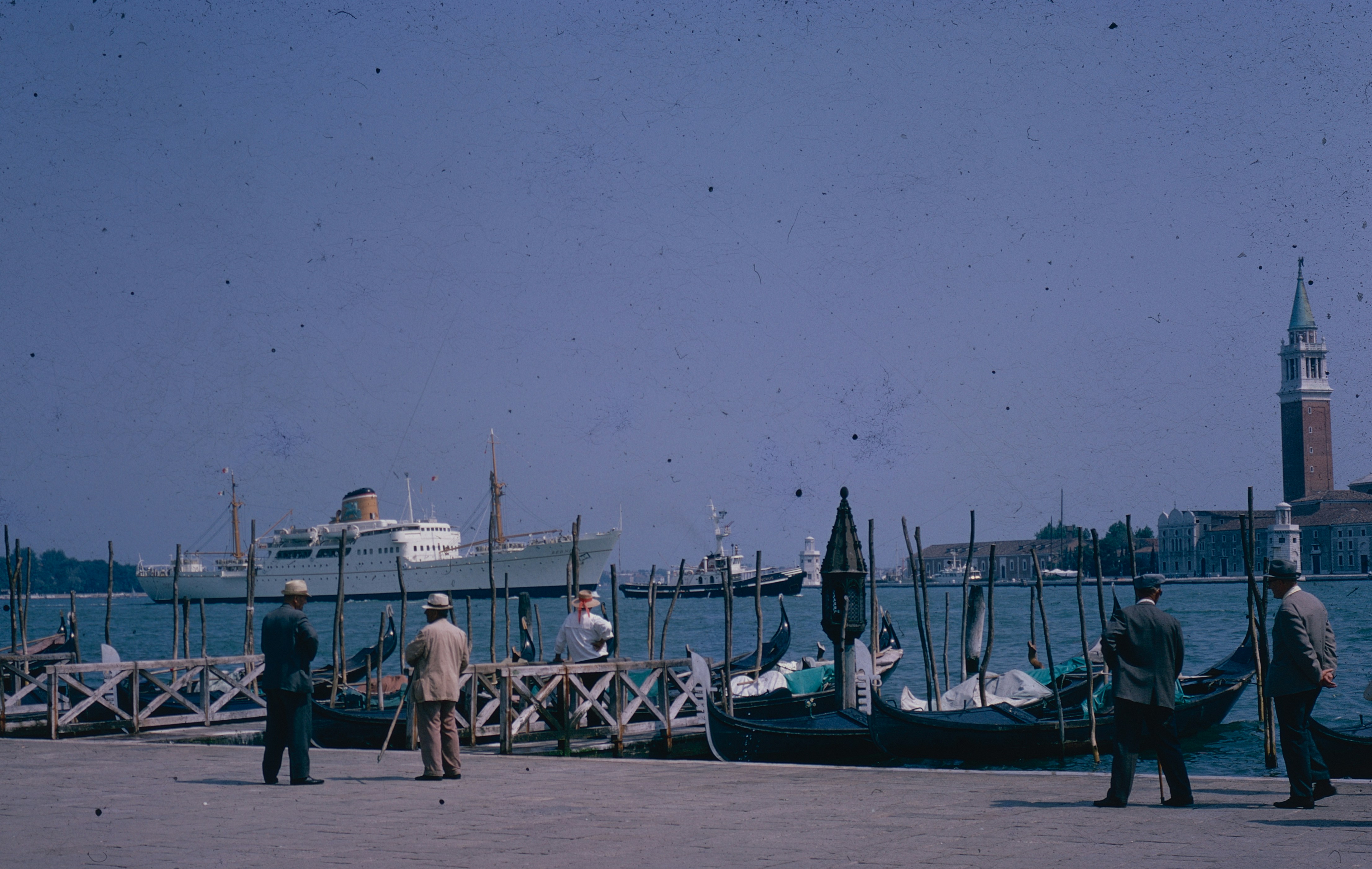 Dockside Convergence: Quiet Parade by Moorings and Boats