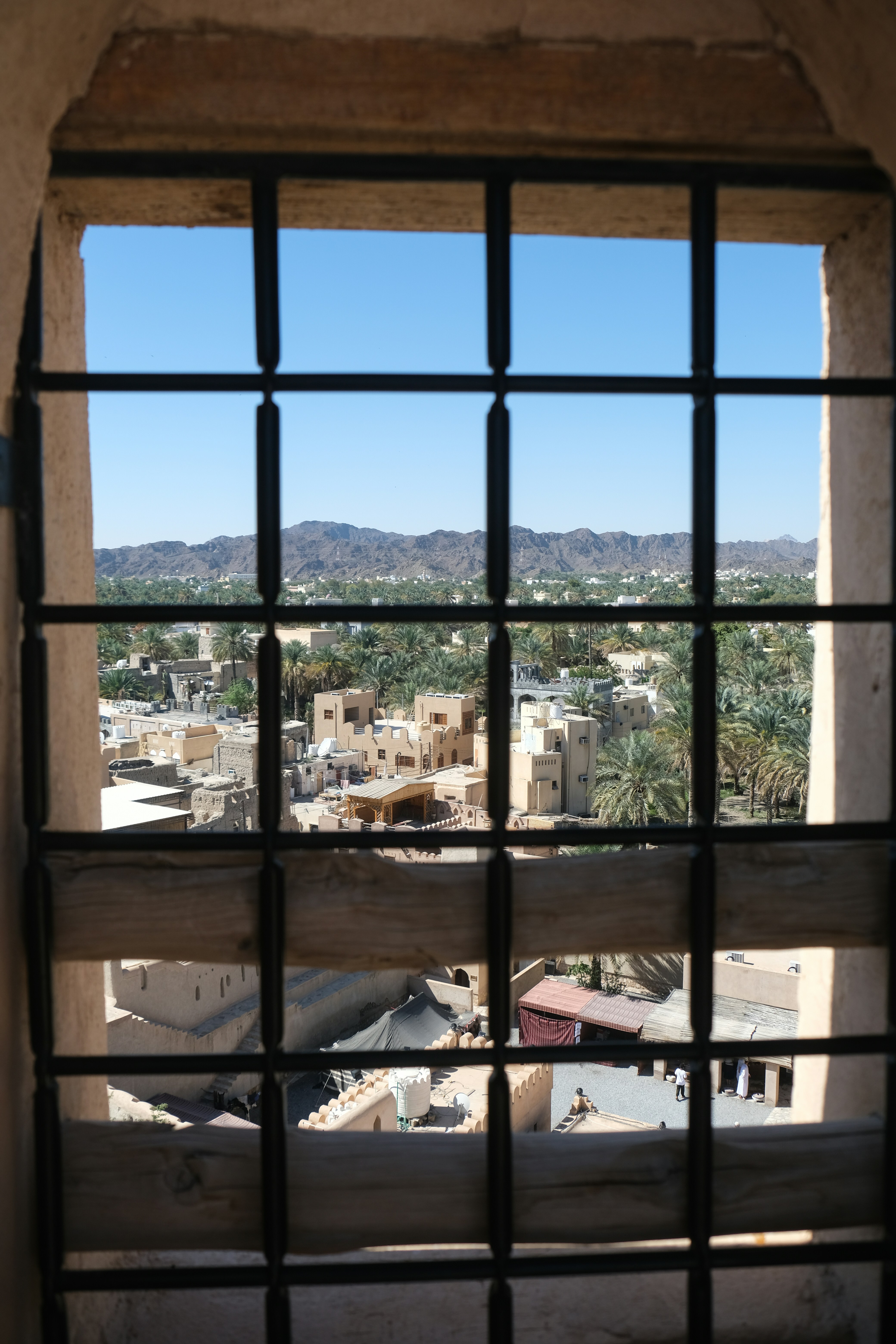 Nizwa Fortress | a view of a city through a window