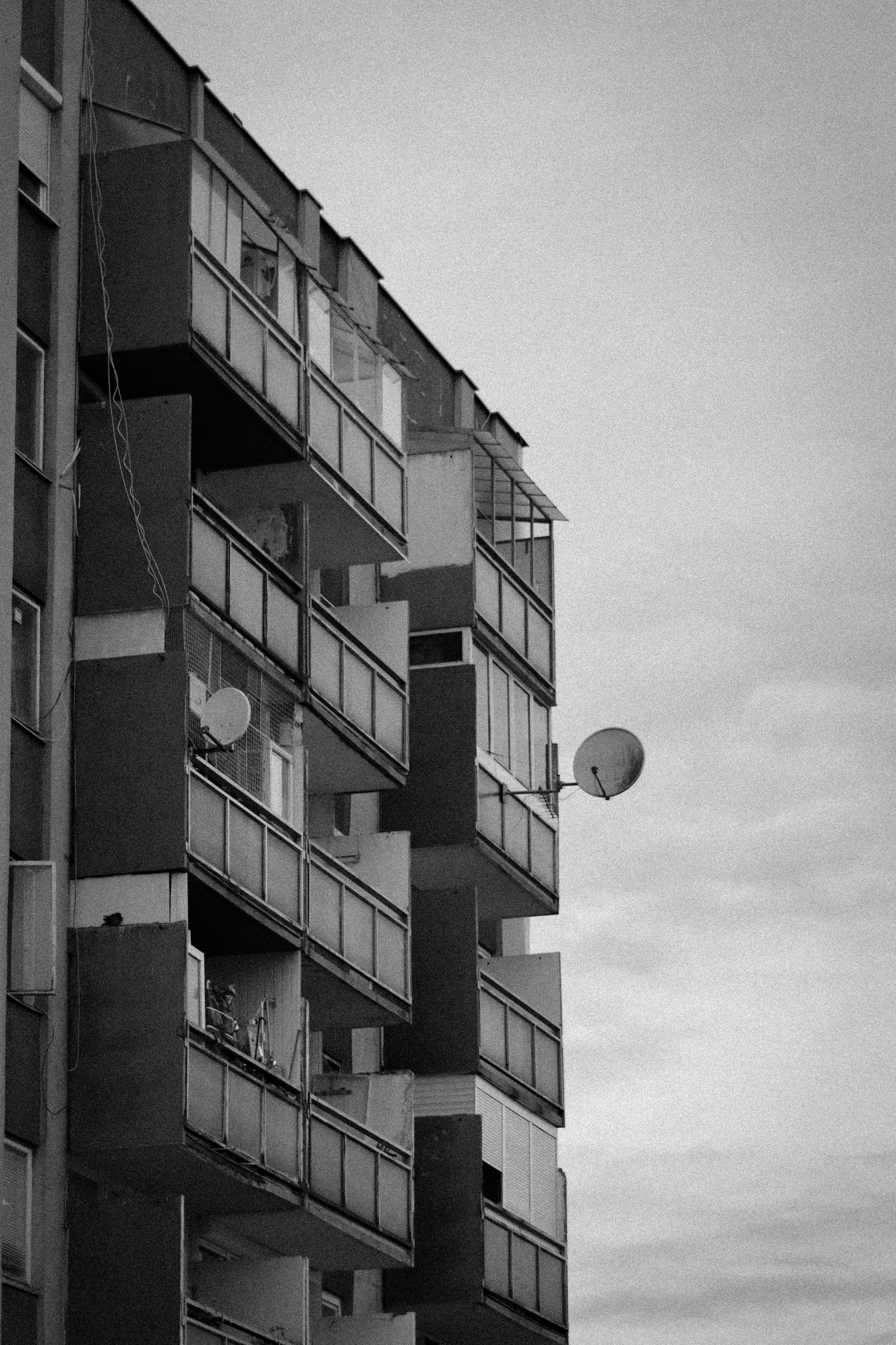 A Geometric and symmetrical view of a building in grey shade.