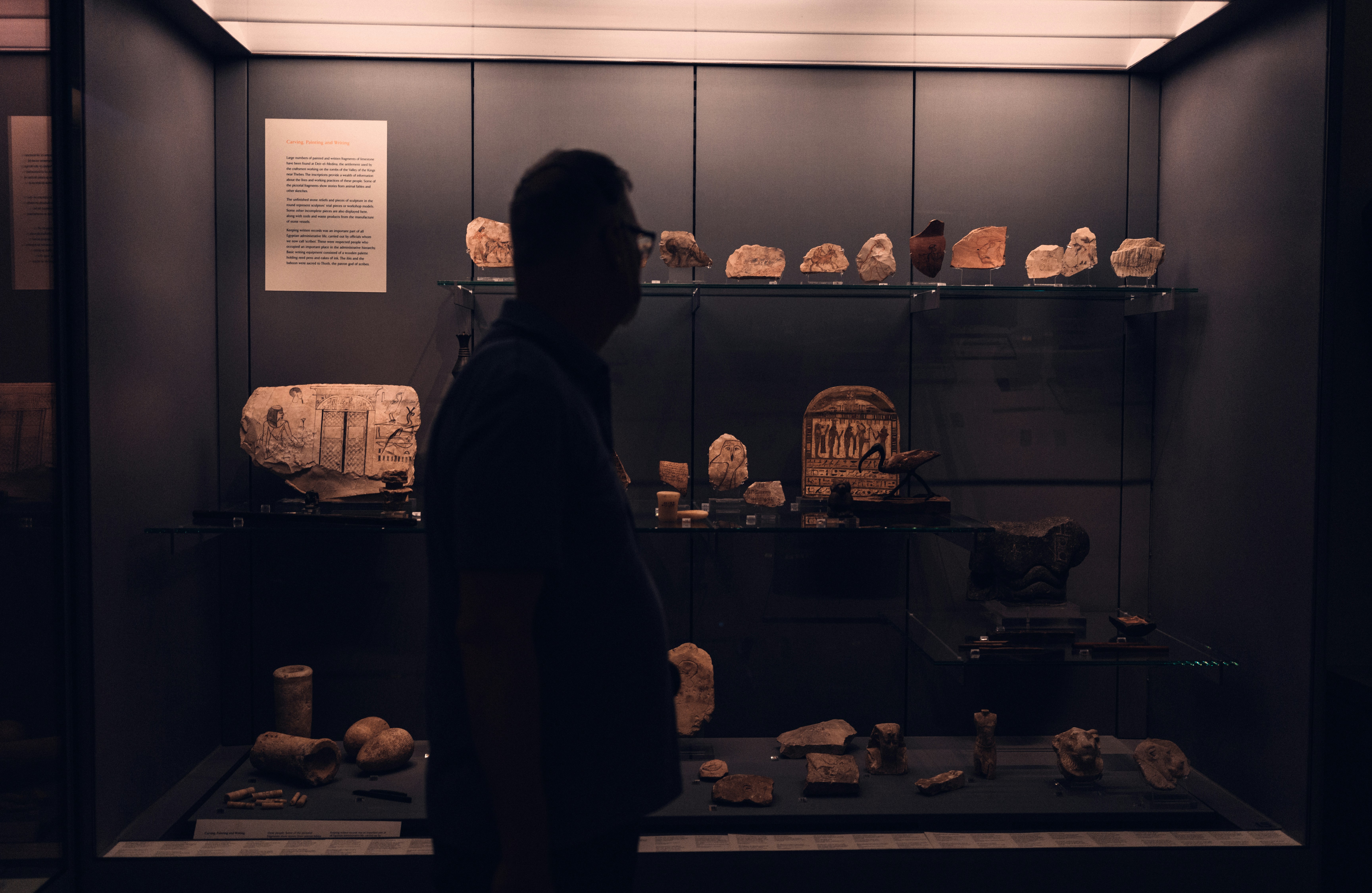Silhouette in the Glass: A Quiet Encounter with Ancient Fragments