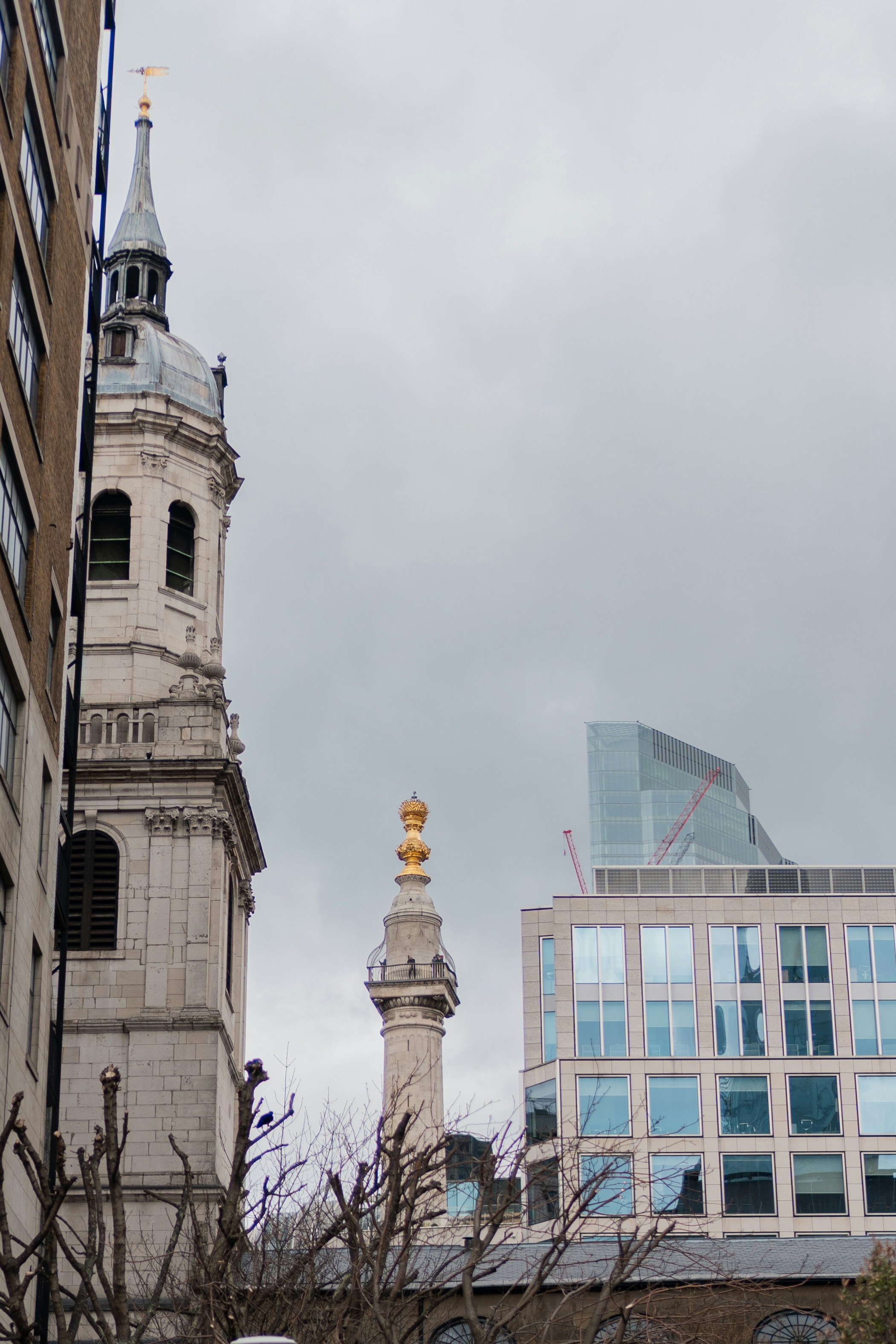 A tall clock tower sitting next to a tall building photo – Free Spire ...