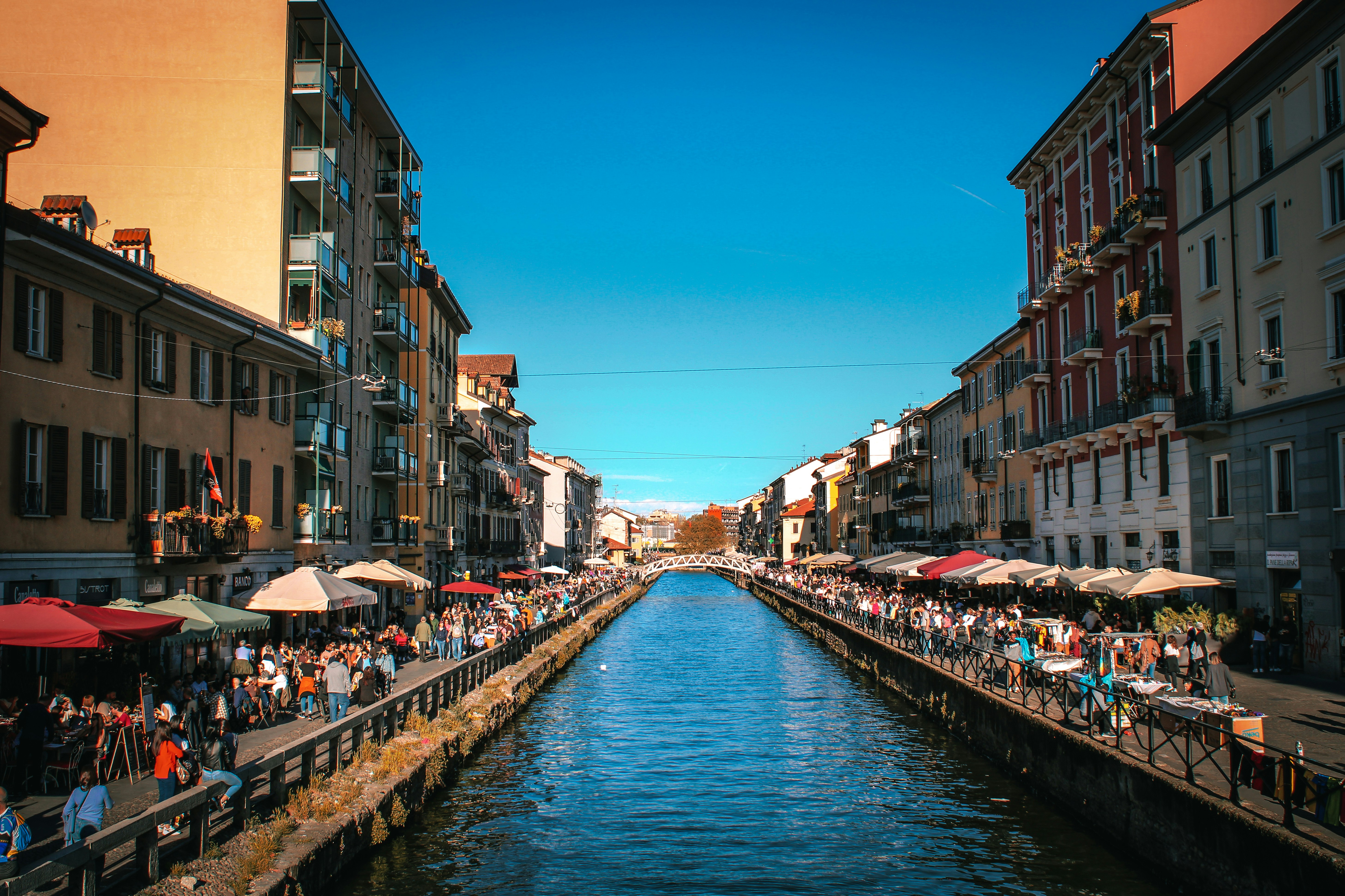 A river running through a city next to tall buildings photo – Free ...