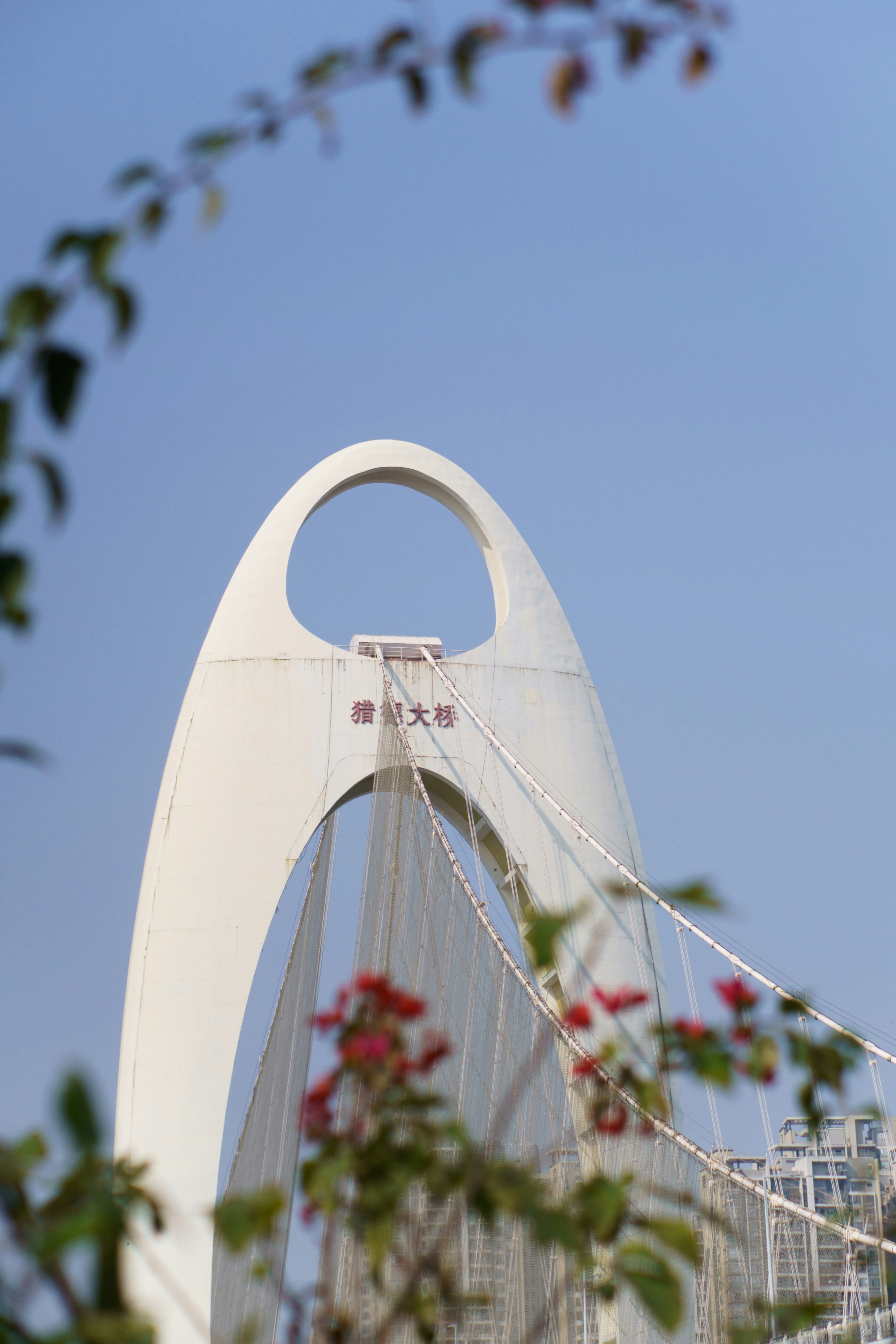 a tall white building with a circular window