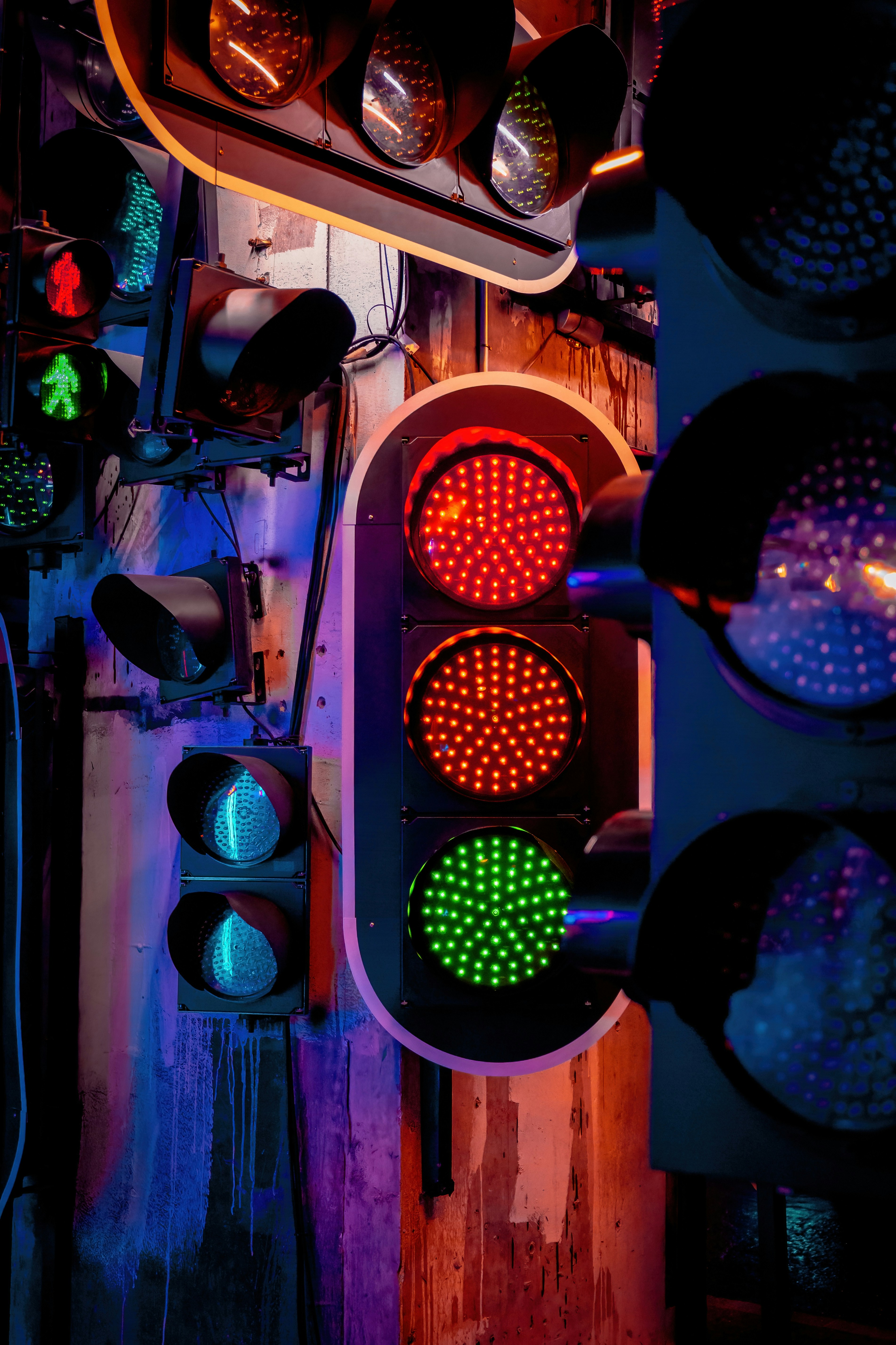 Circular Red Core Amid Neon Traffic Signals