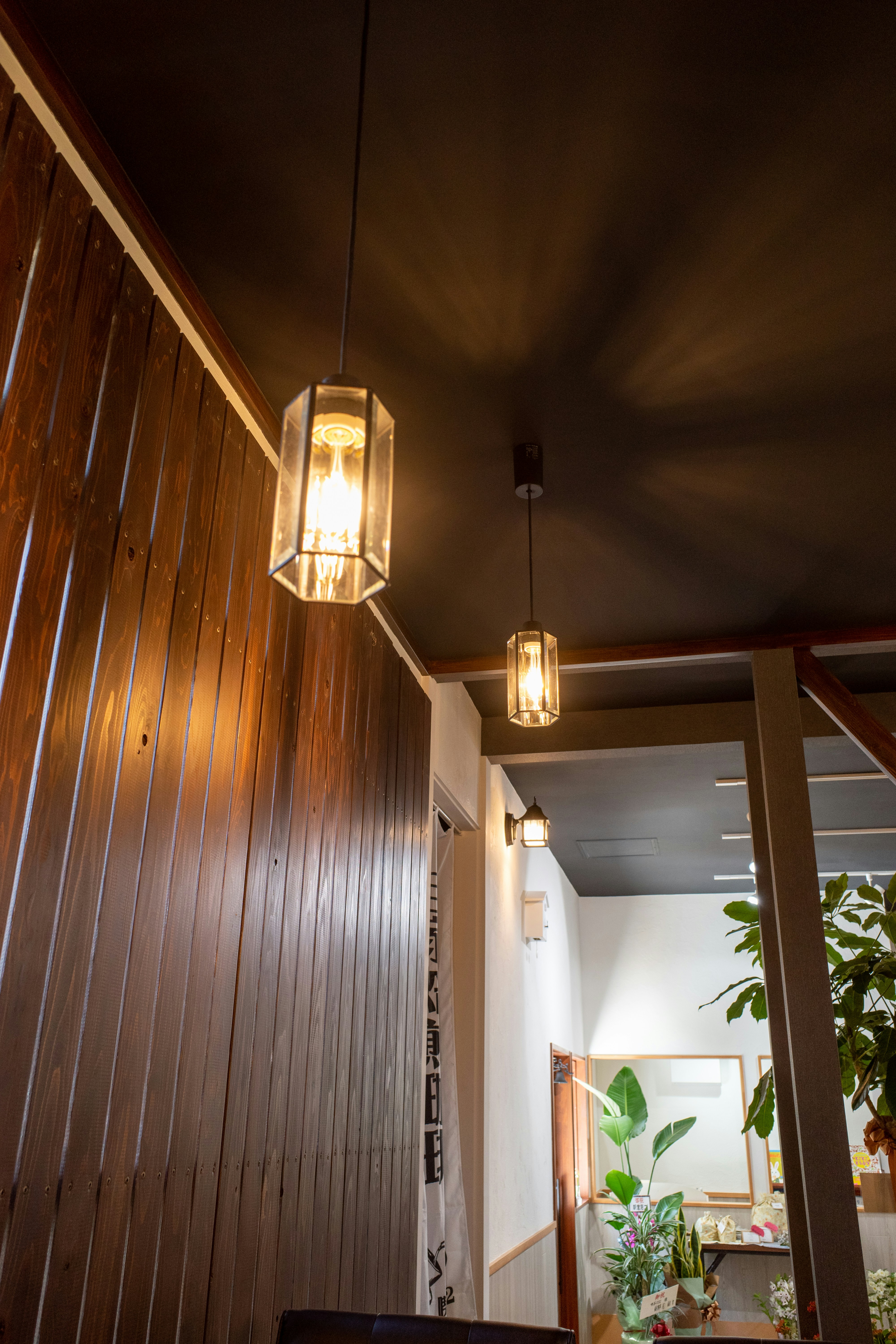 A couple of lights hanging from a ceiling photo – Free Indoors Image on ...