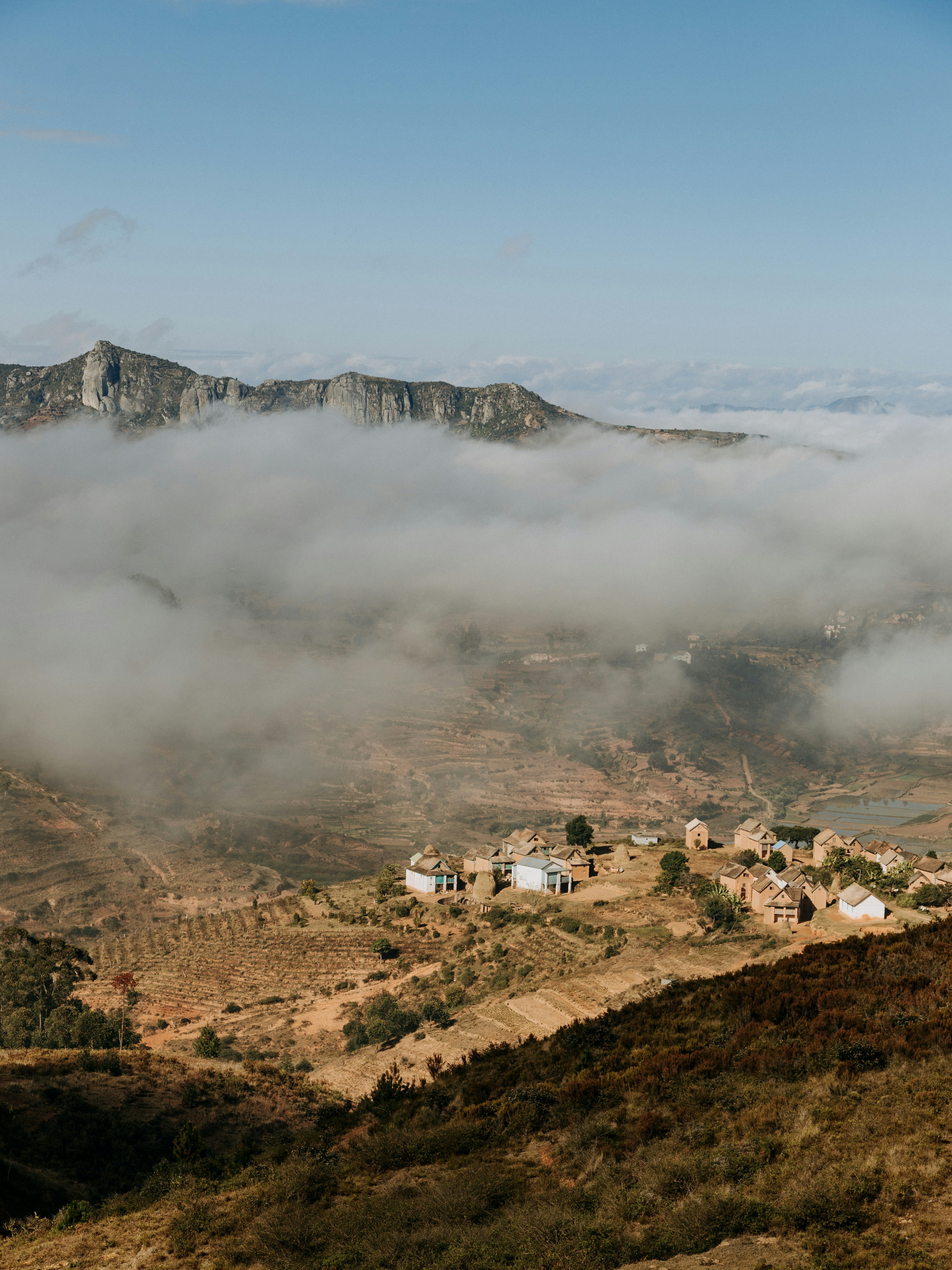 Ridge Above the Cloud Veil: Dawn over a Highland Village