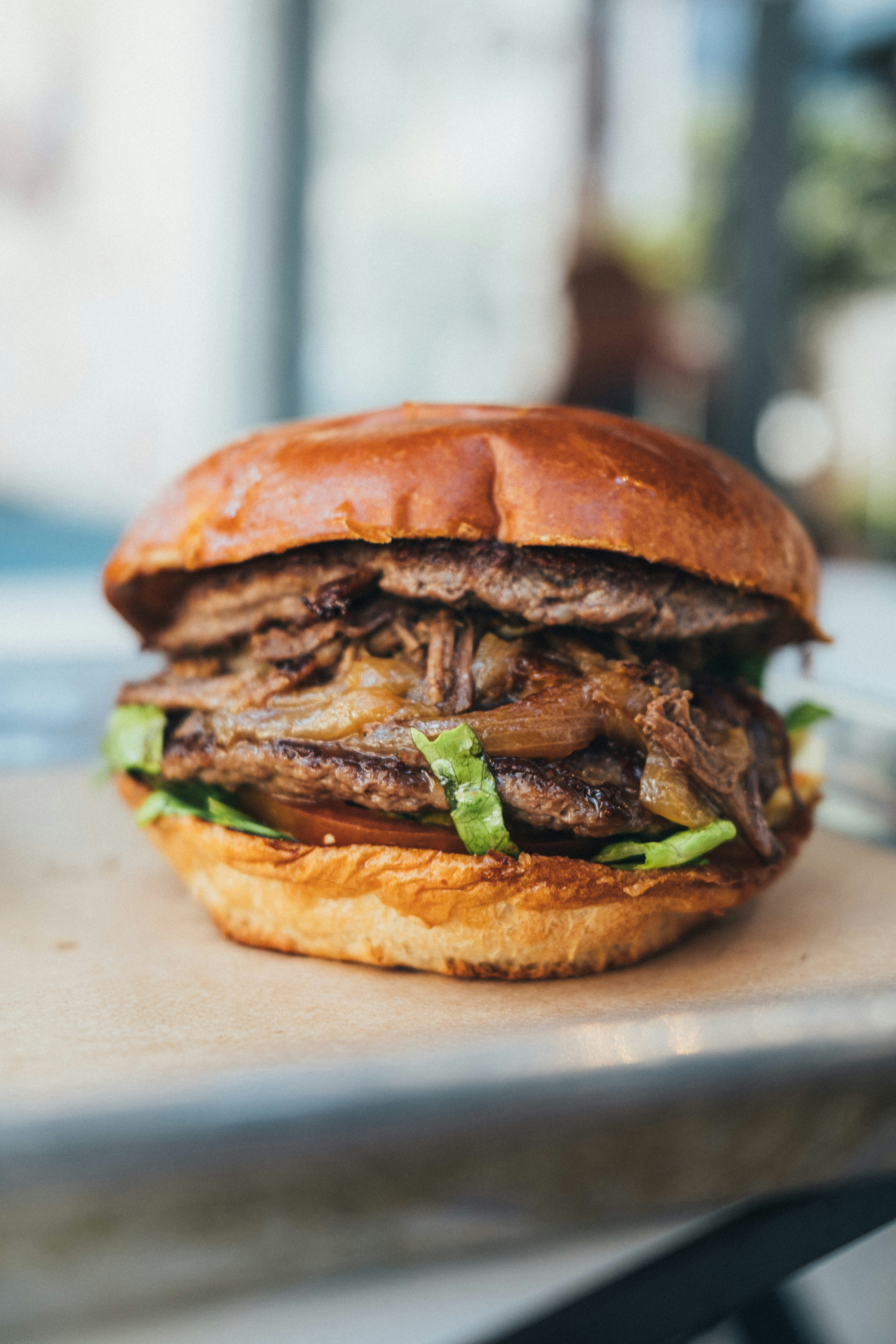A close up of a sandwich on a table photo – Free America burgers Image ...