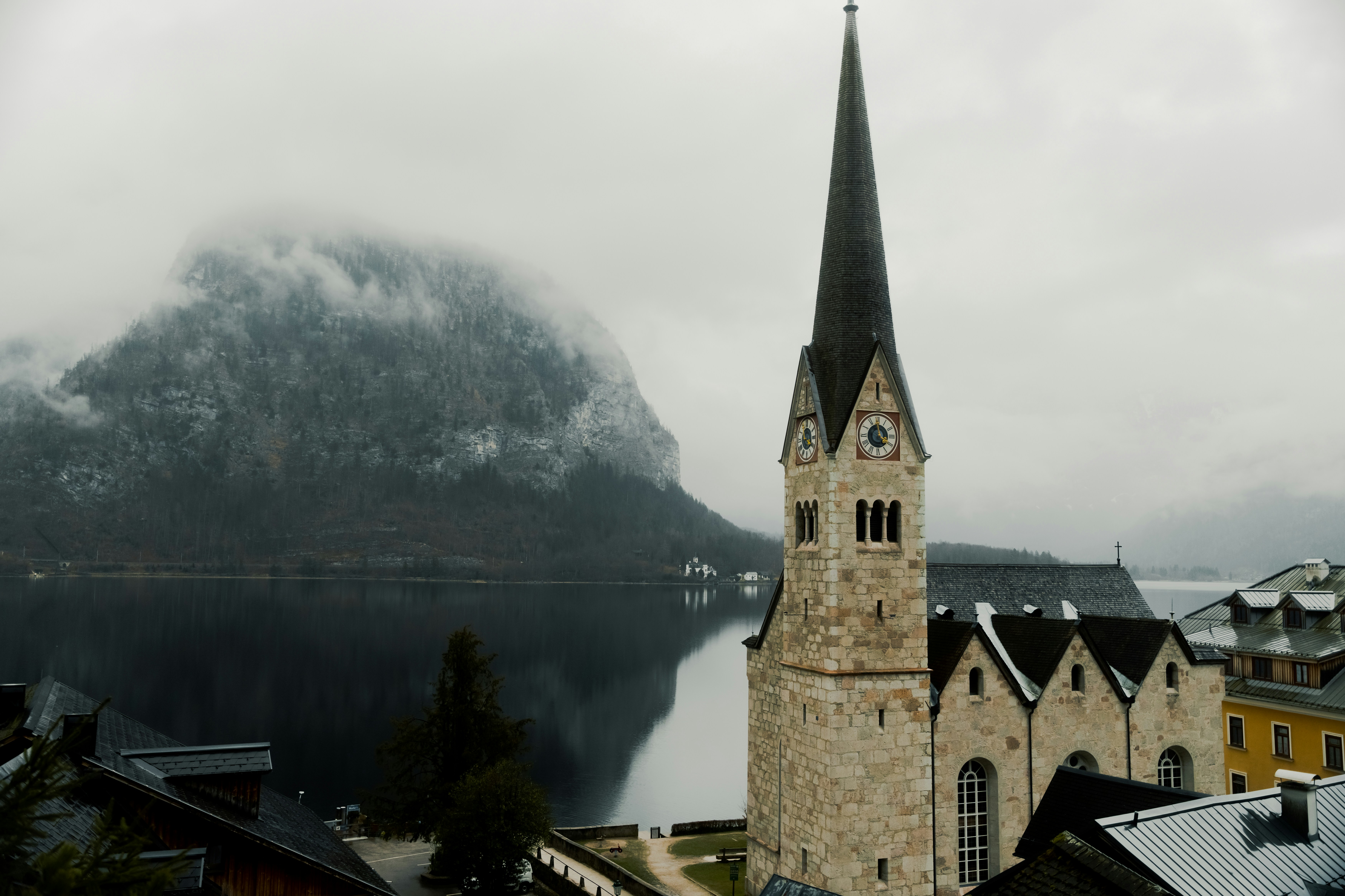 A church steeple with a mountain in the background photo – Free Spire ...