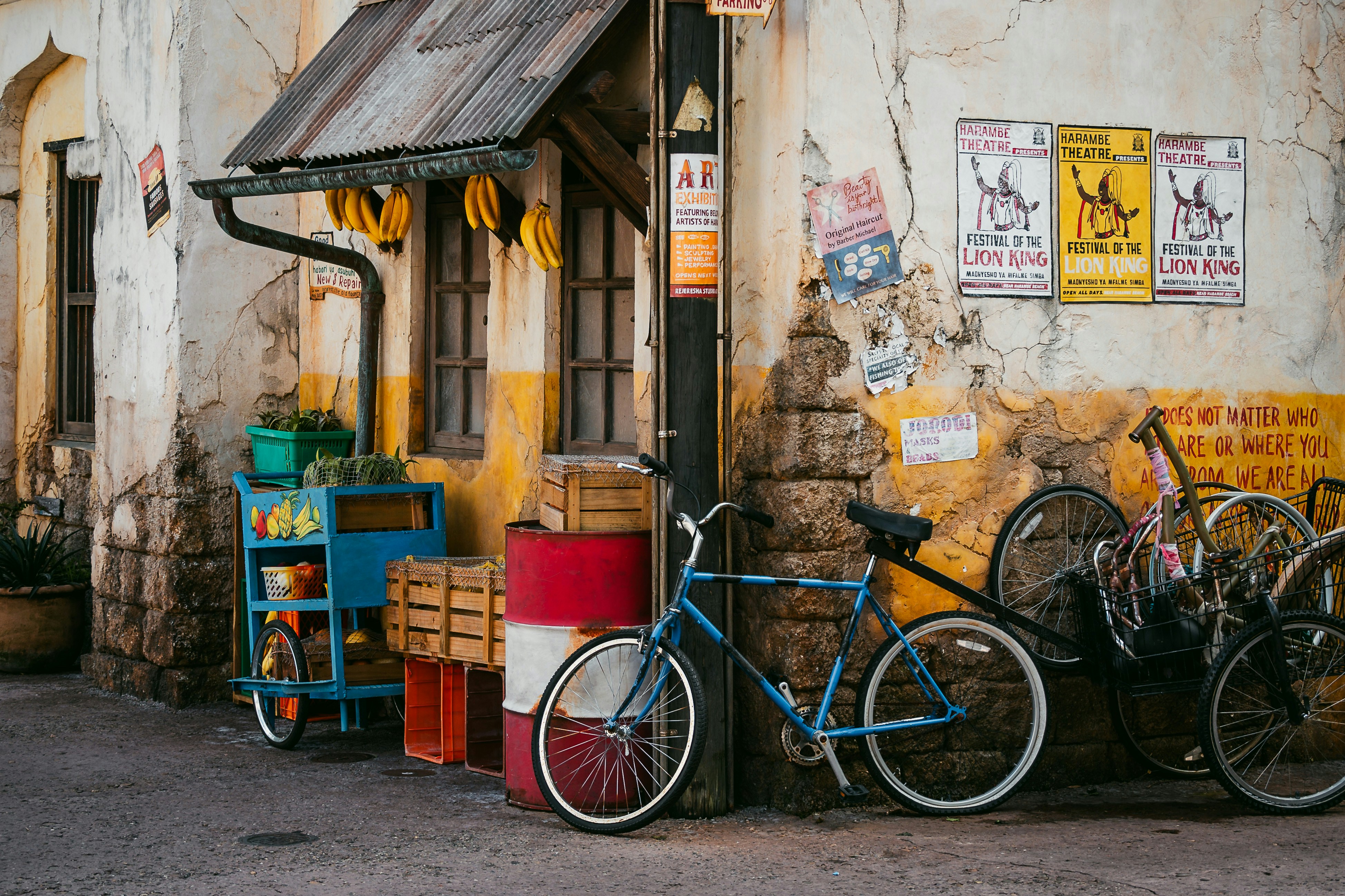 Vintage signs and bicycles in an African street market side alley.