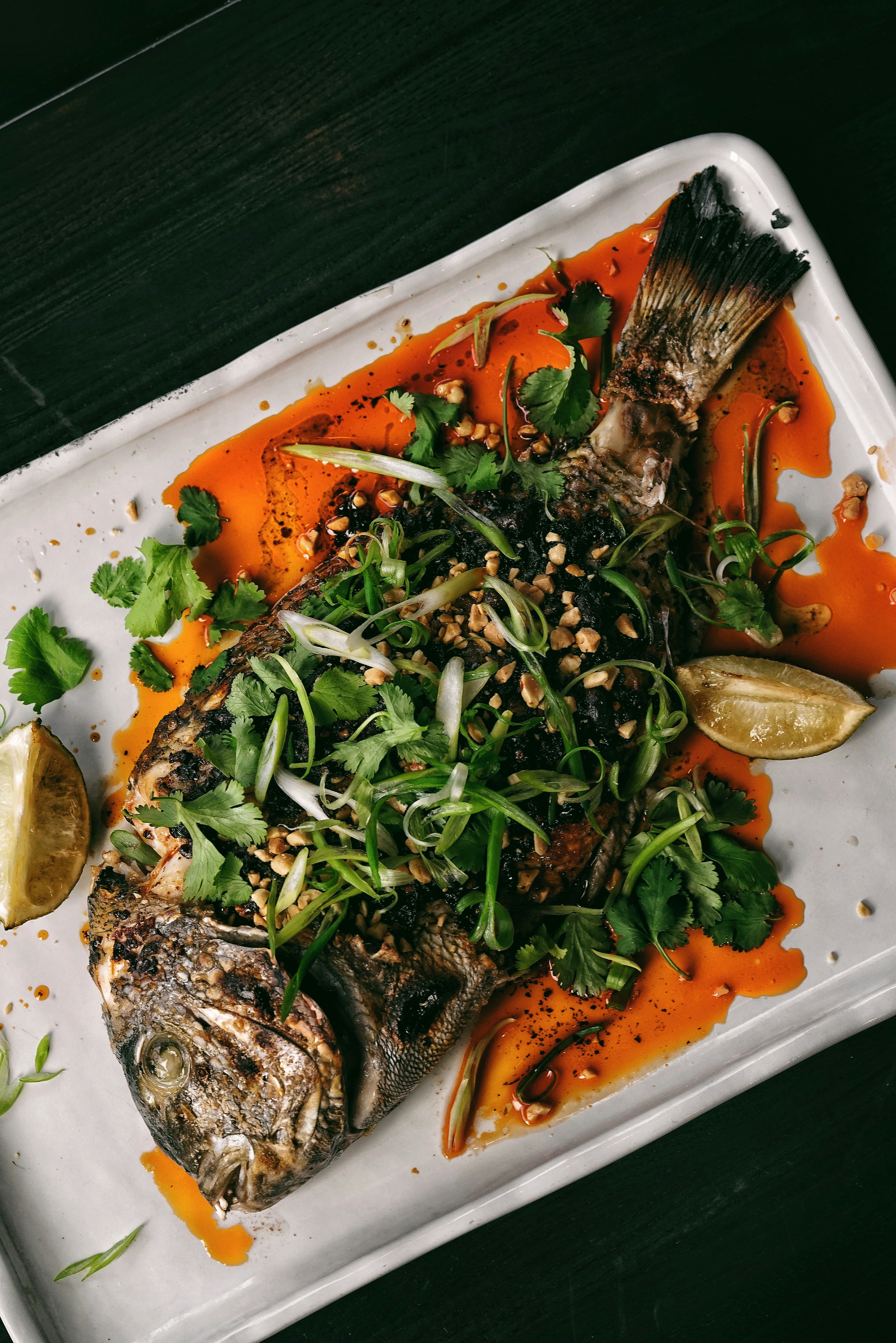 Citrus-Spiced Whole Fish with Herb Garnish and Fiery Sauce
