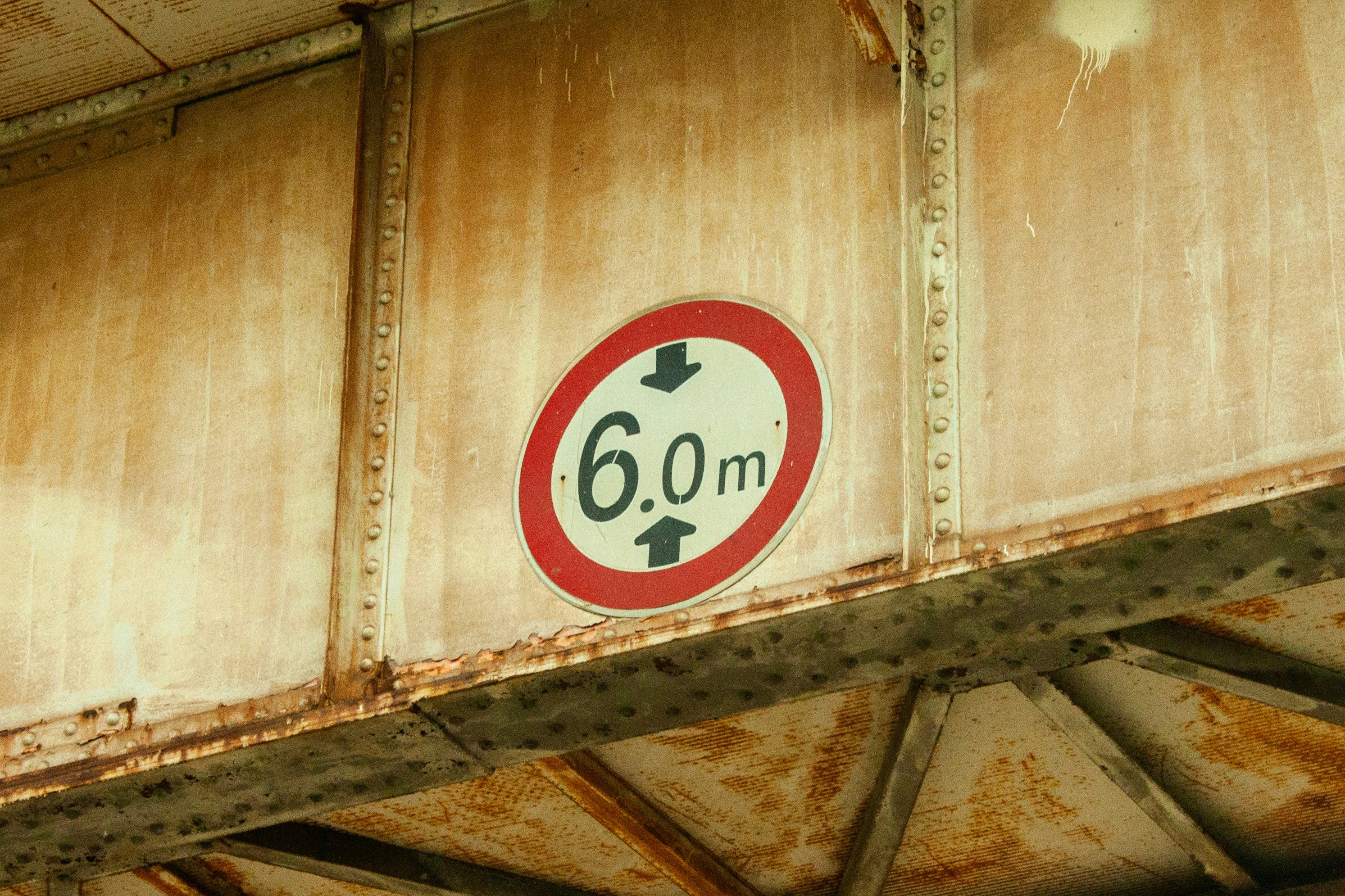 Rusting under the Bridge: 6.0m Sign Amid Steel and Decay