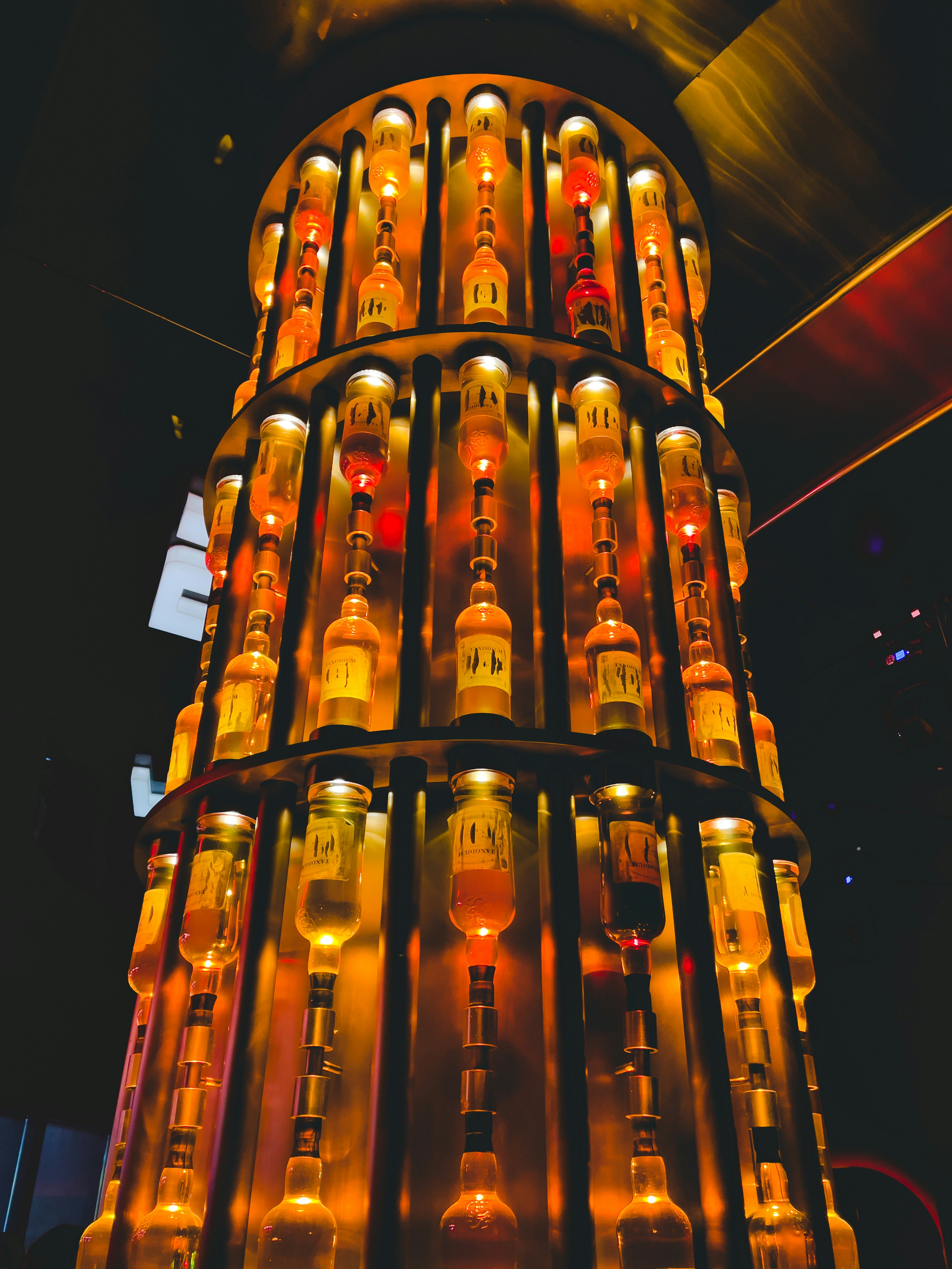 A very tall tower made out of bottles photo – Free Alcohol Image on ...