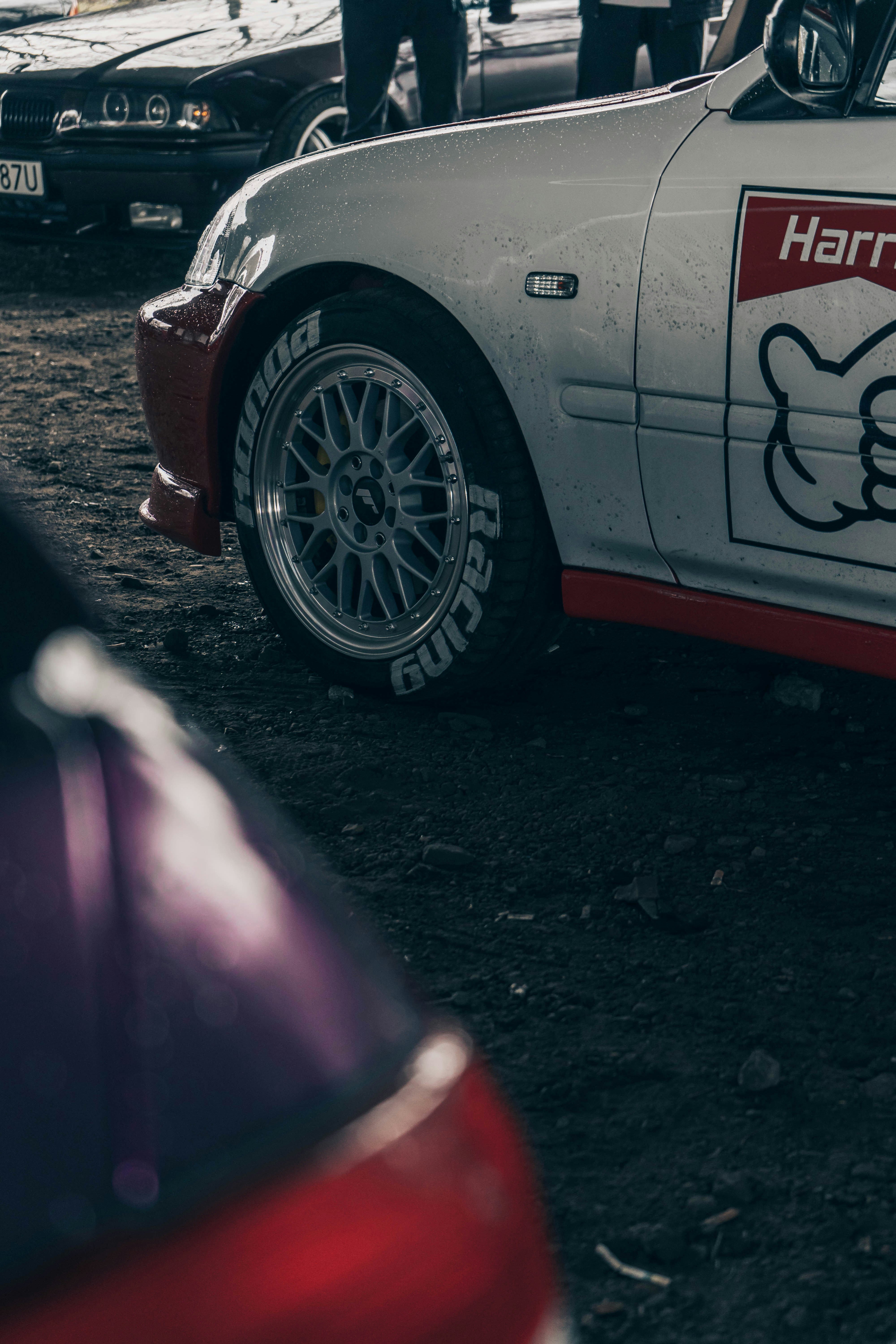 Grain and Glint: Close-Up of a Race-Car Wheel in the Paddock