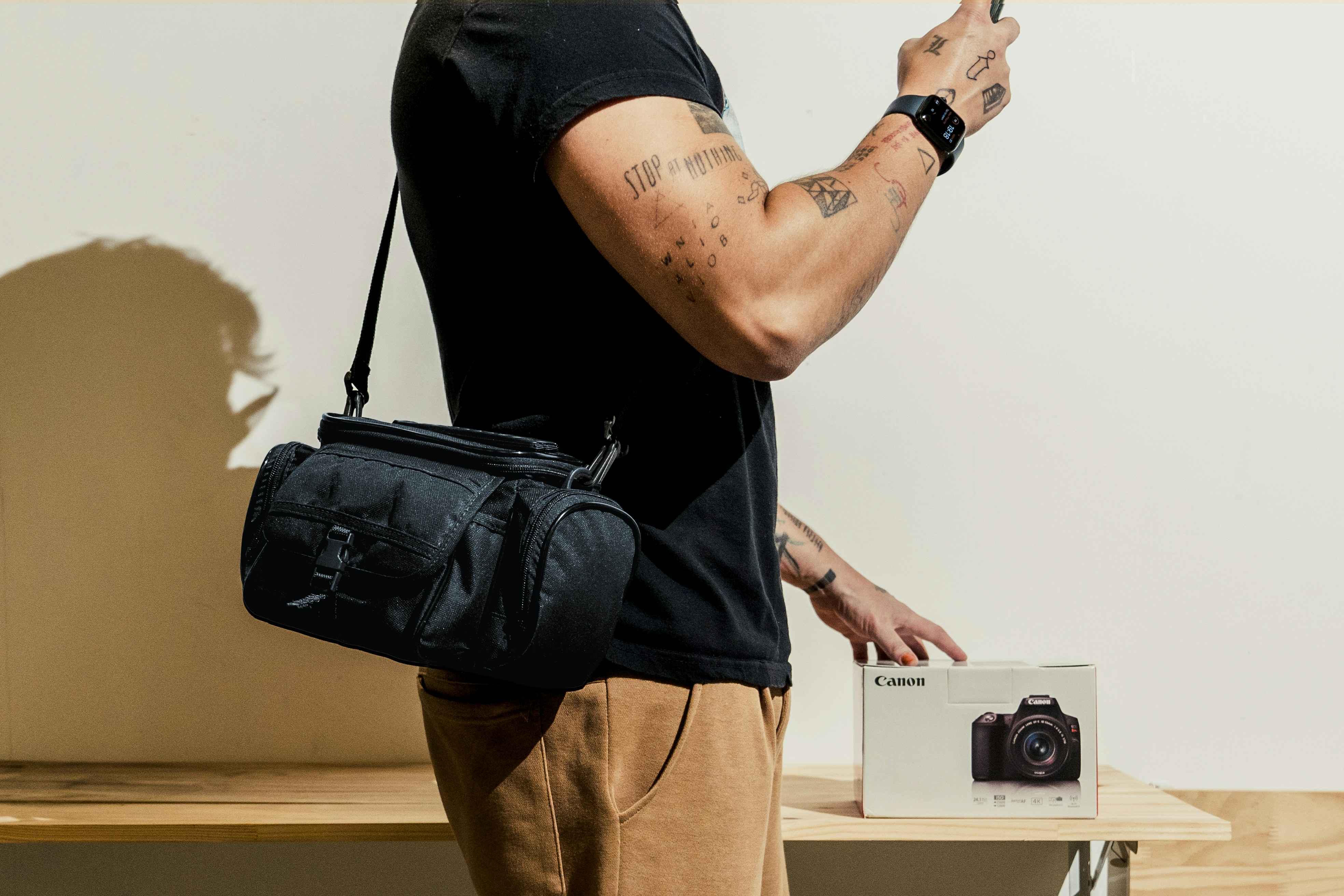Unboxing Focus: Canon Box Framed by a Casual Studio Moment