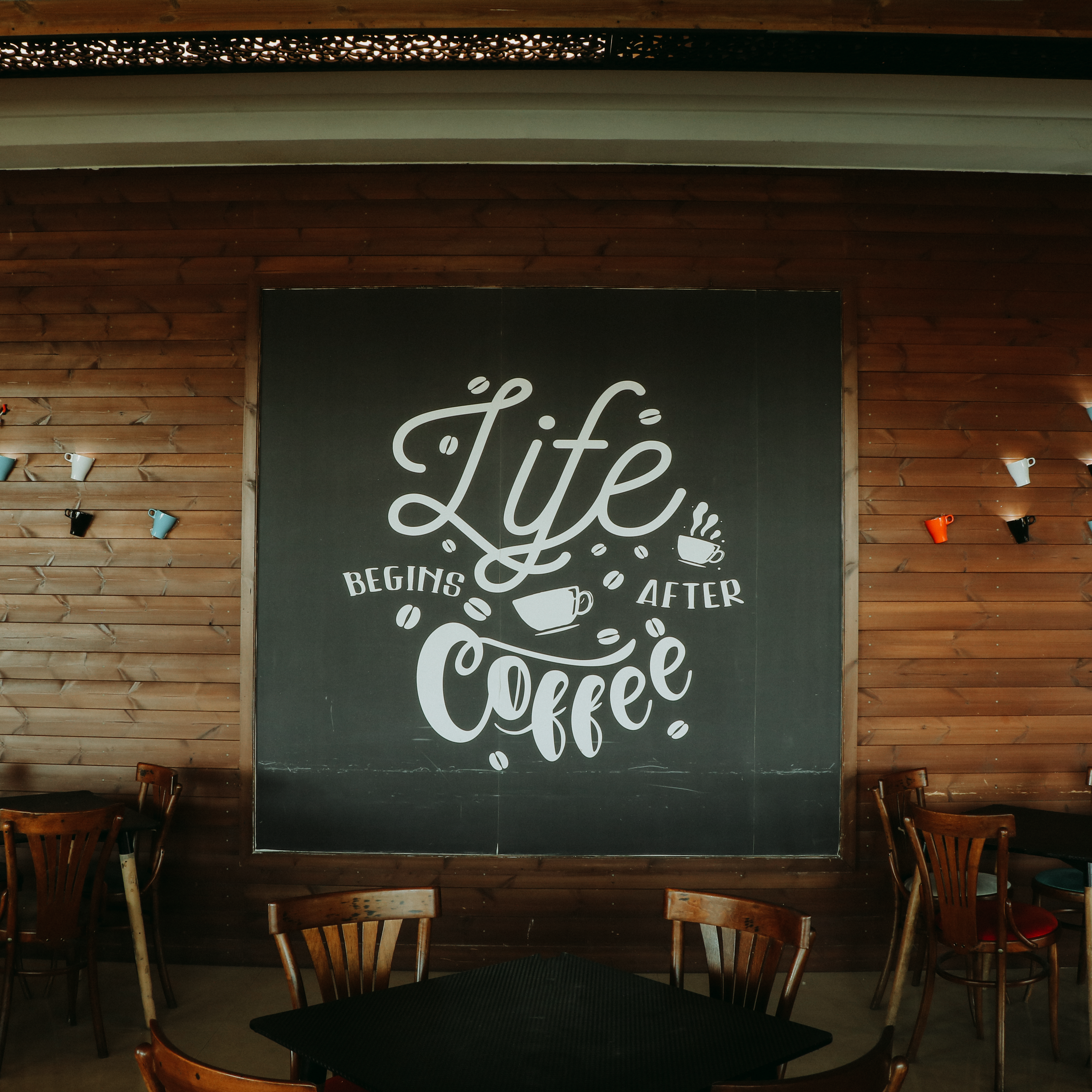 A chalkboard with the words life begins after coffee written on it ...
