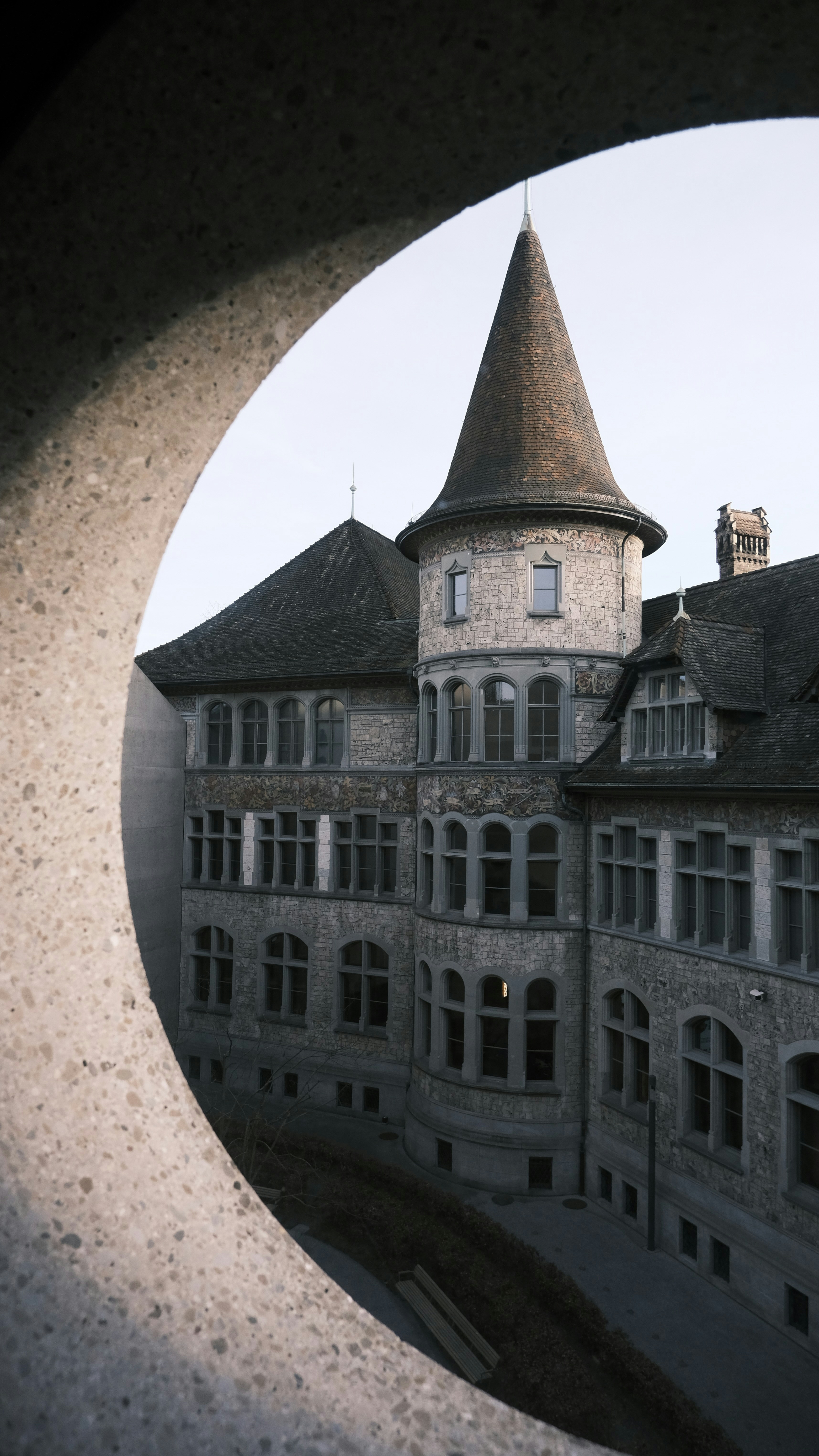 Circular Frame, Turreted Castle: A Stone Facade Framed by a Ring