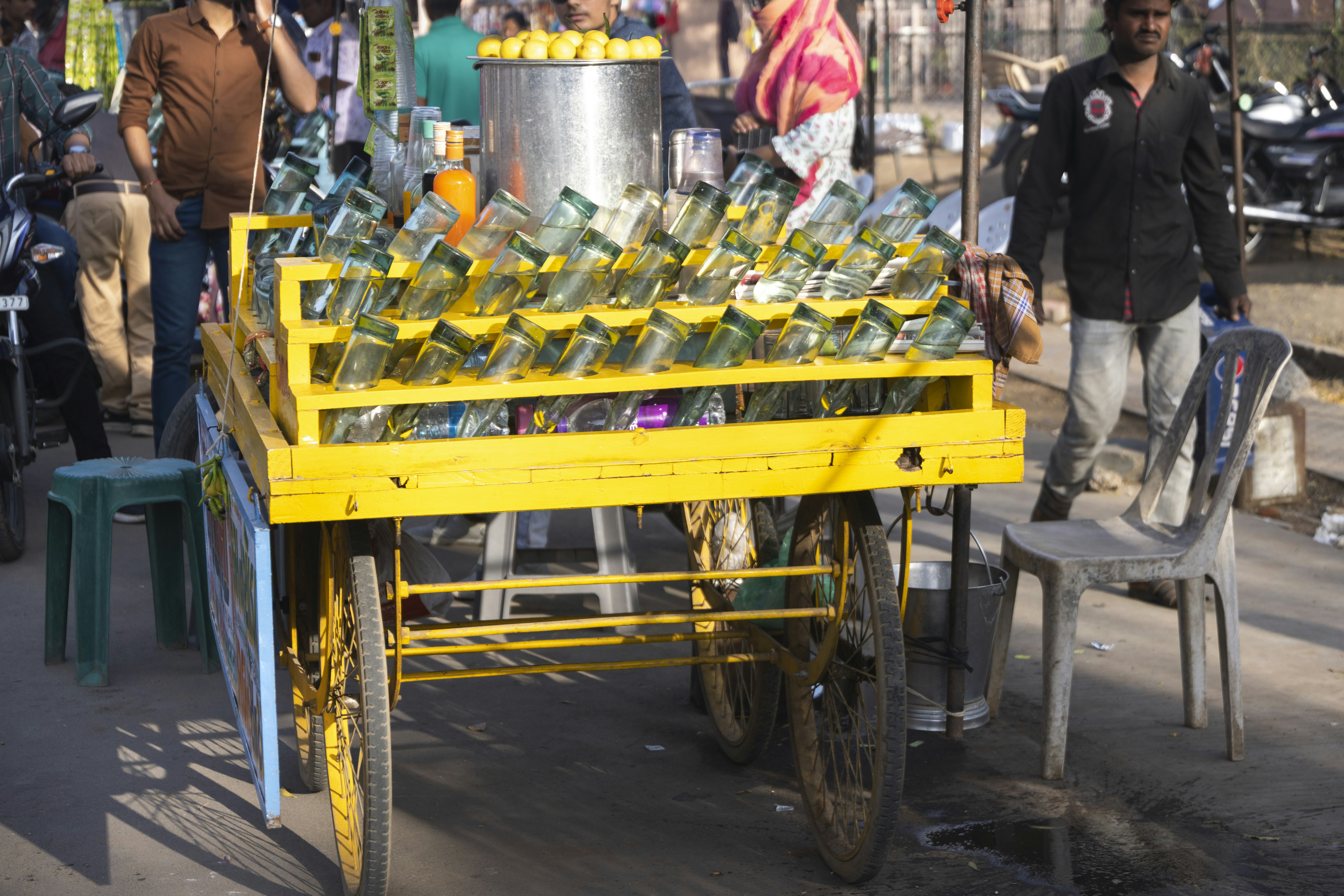 Yellow Fruit Cart Brimming with Bottled Treats in a Local Market