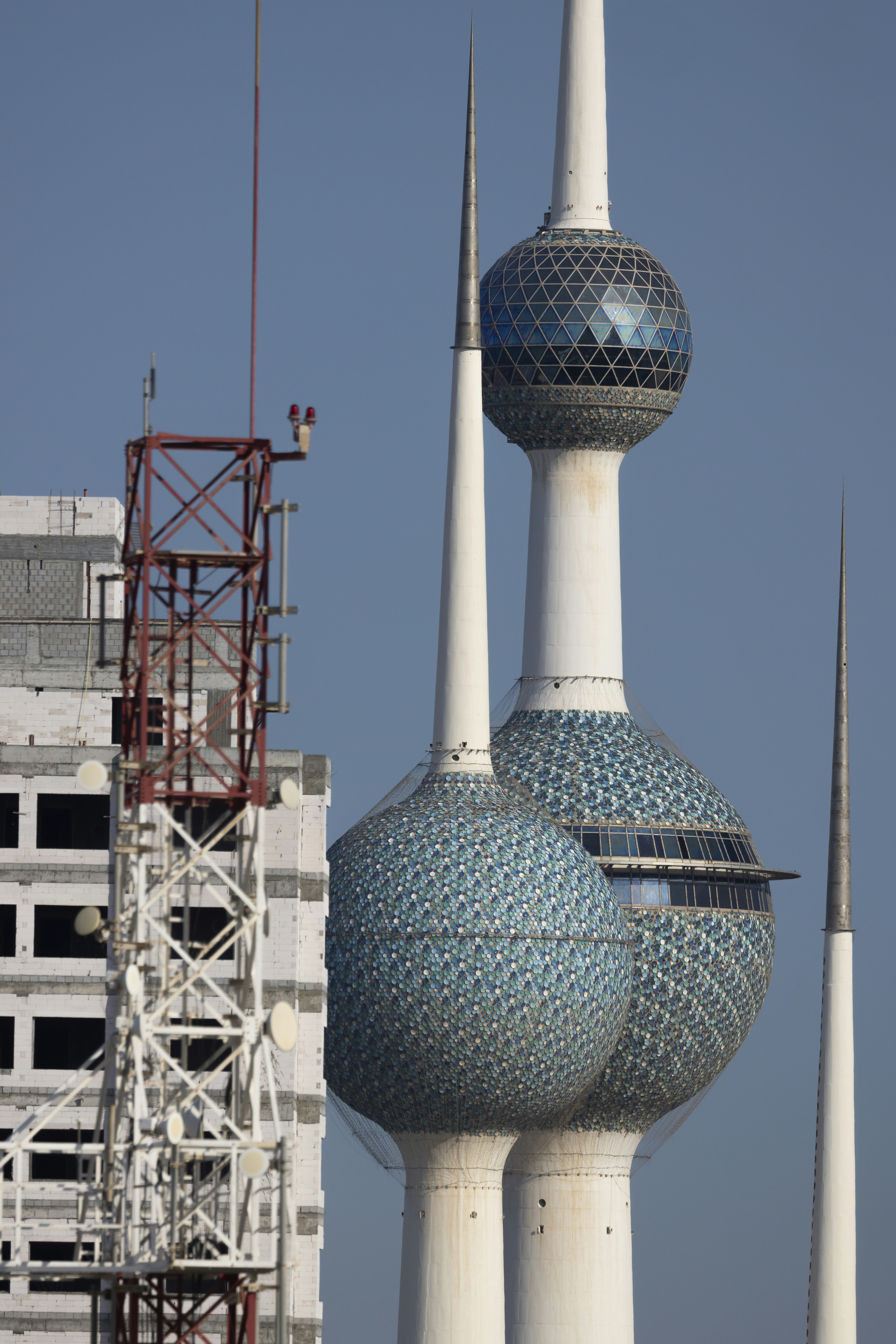 A tall building with a very tall tower next to it photo – Free Kuwait ...