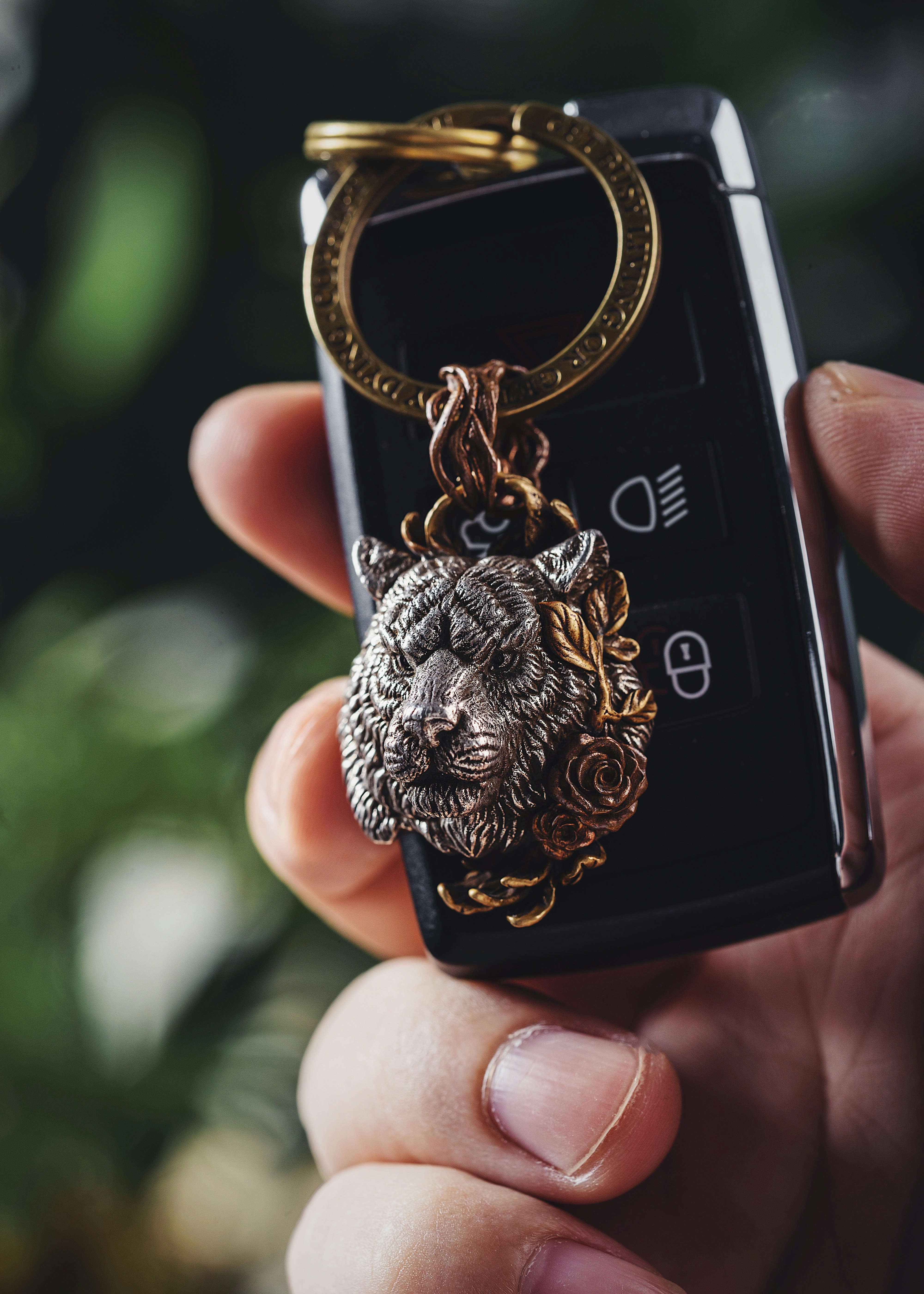 Keyring Keepsake: A Metallic Lion Pendant Dangles from a Modern Car Key