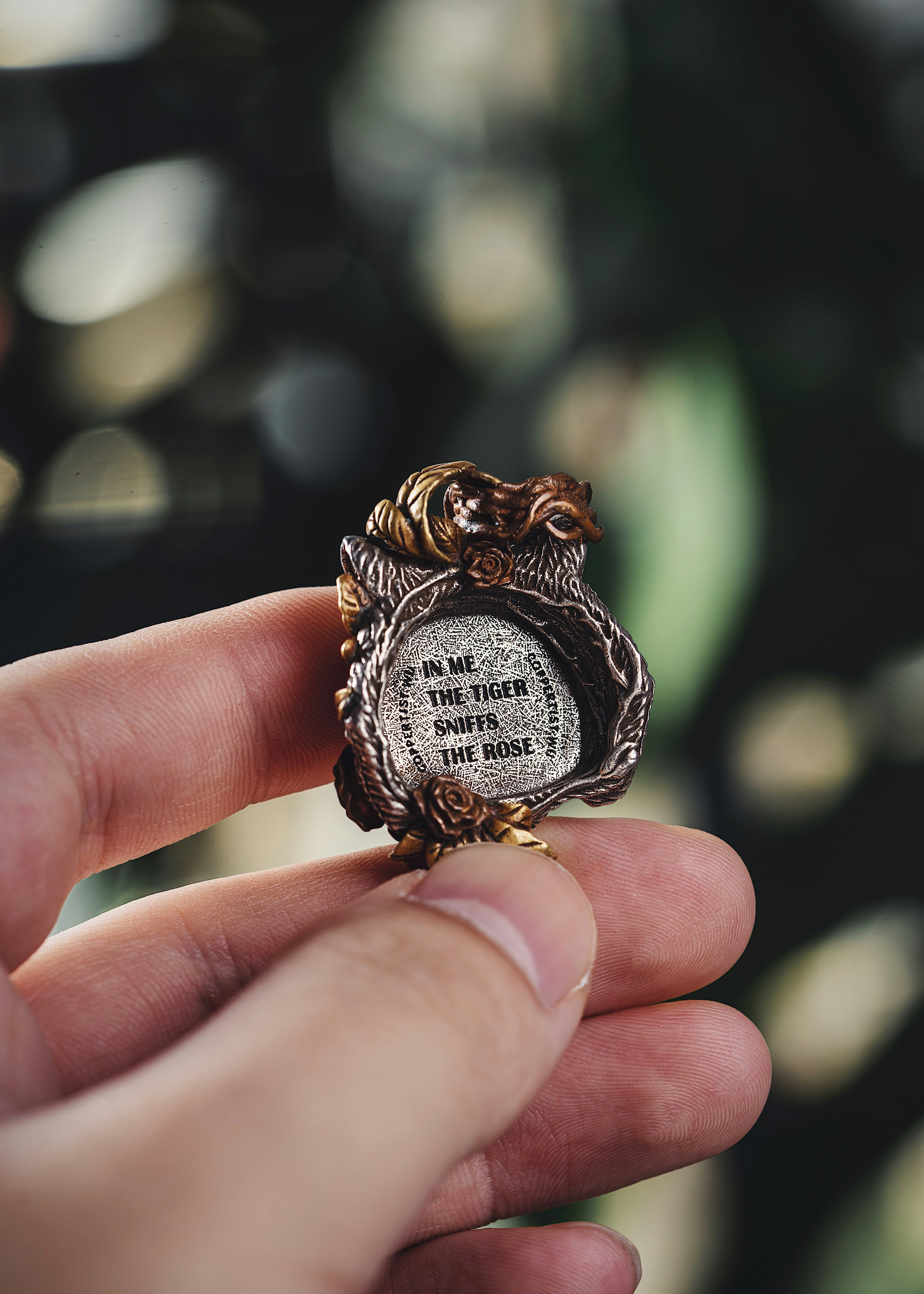 Whispered Proverb in Metal: A Tiny Talisman Between Fingers
